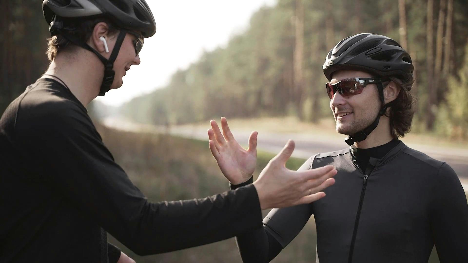 Two Bicyclist Shaking Hands · Free Stock Video