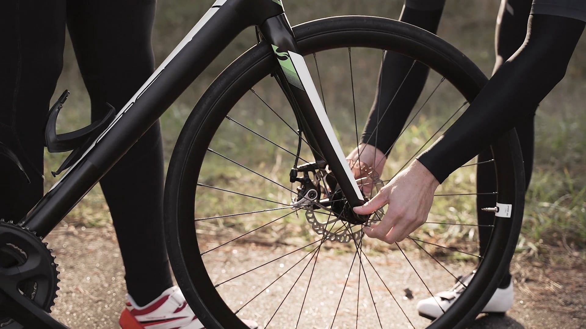 Cyclists Adjusting Bicycle Wheel on Forest Road Free Stock Video ...