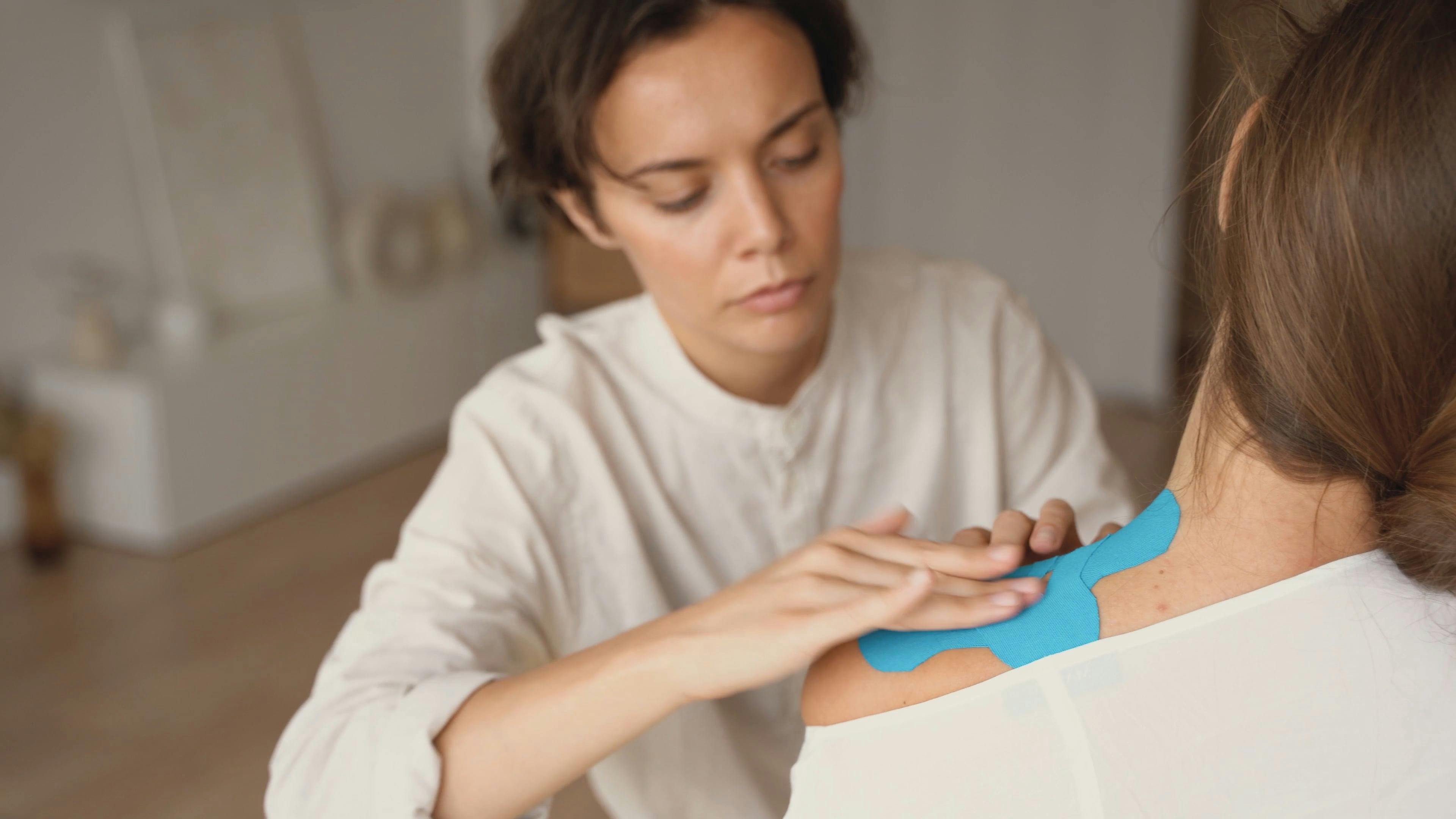 Professional Taping a Person's Back · Free Stock Video