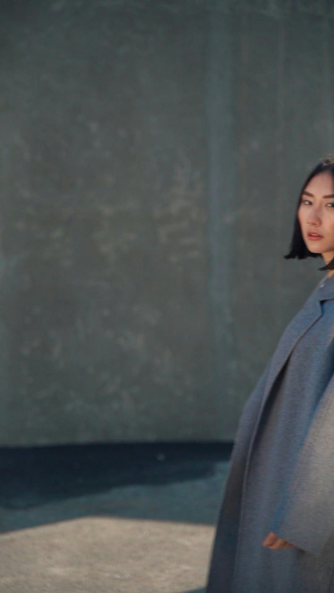 Faceless Woman Modeling with a Grey Dress · Free Stock Video