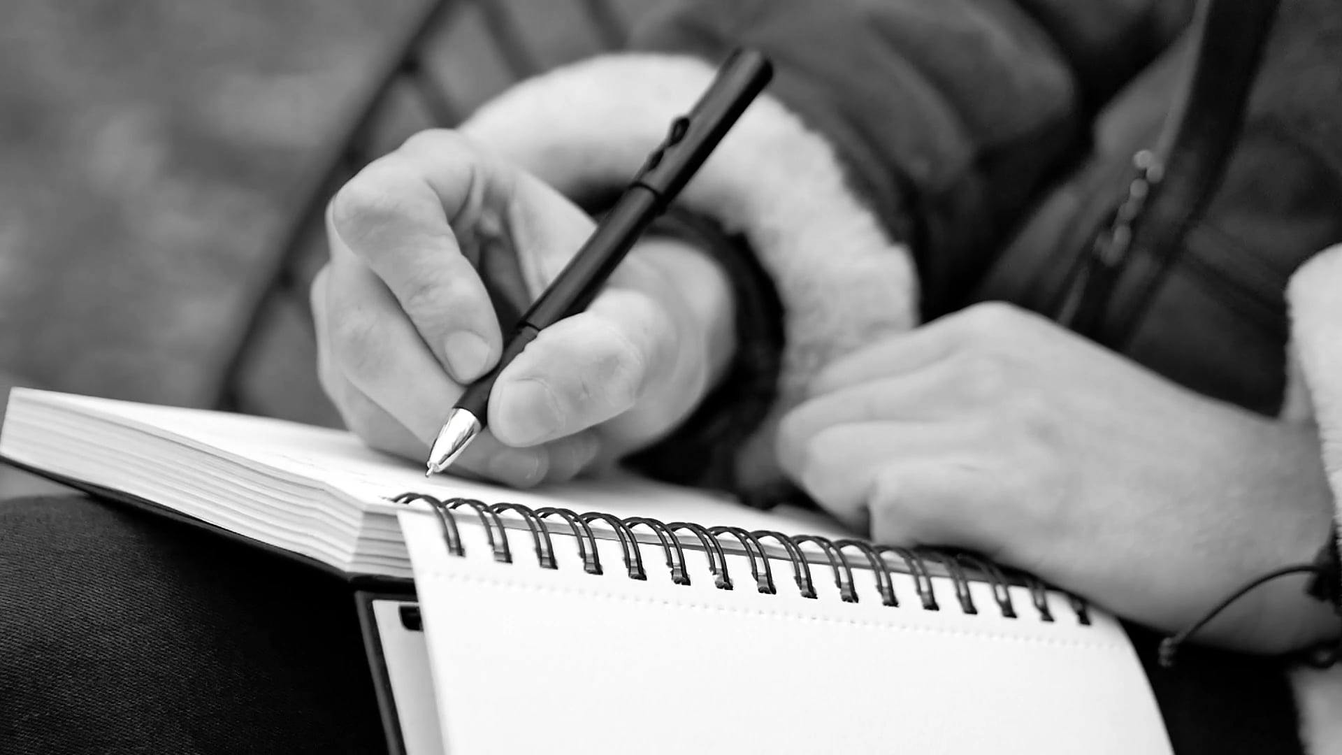 A Man In A Business Meeting About To Write On His His Appointment Book ...