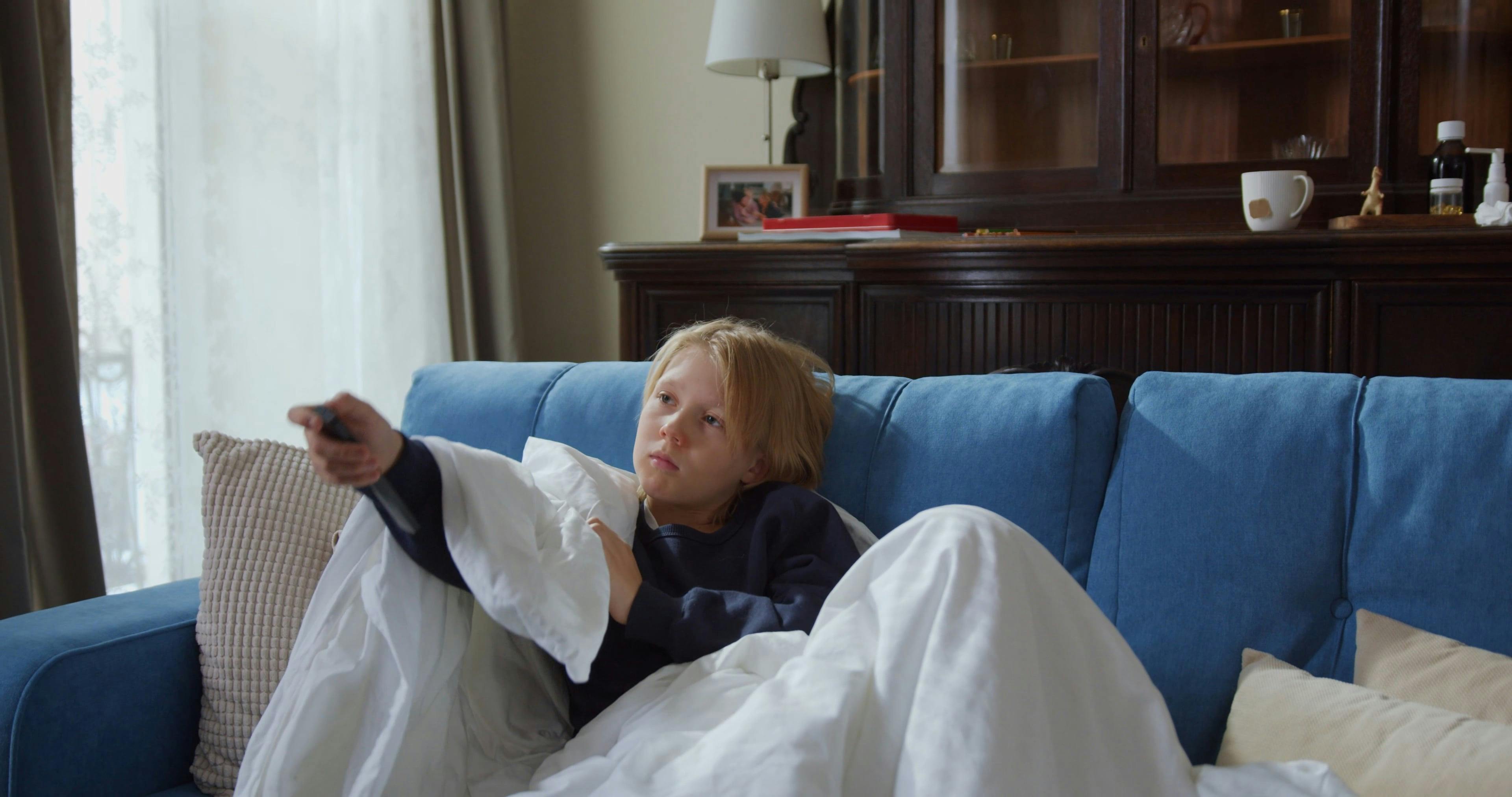 A Sick Kid Watching Television · Free Stock Video