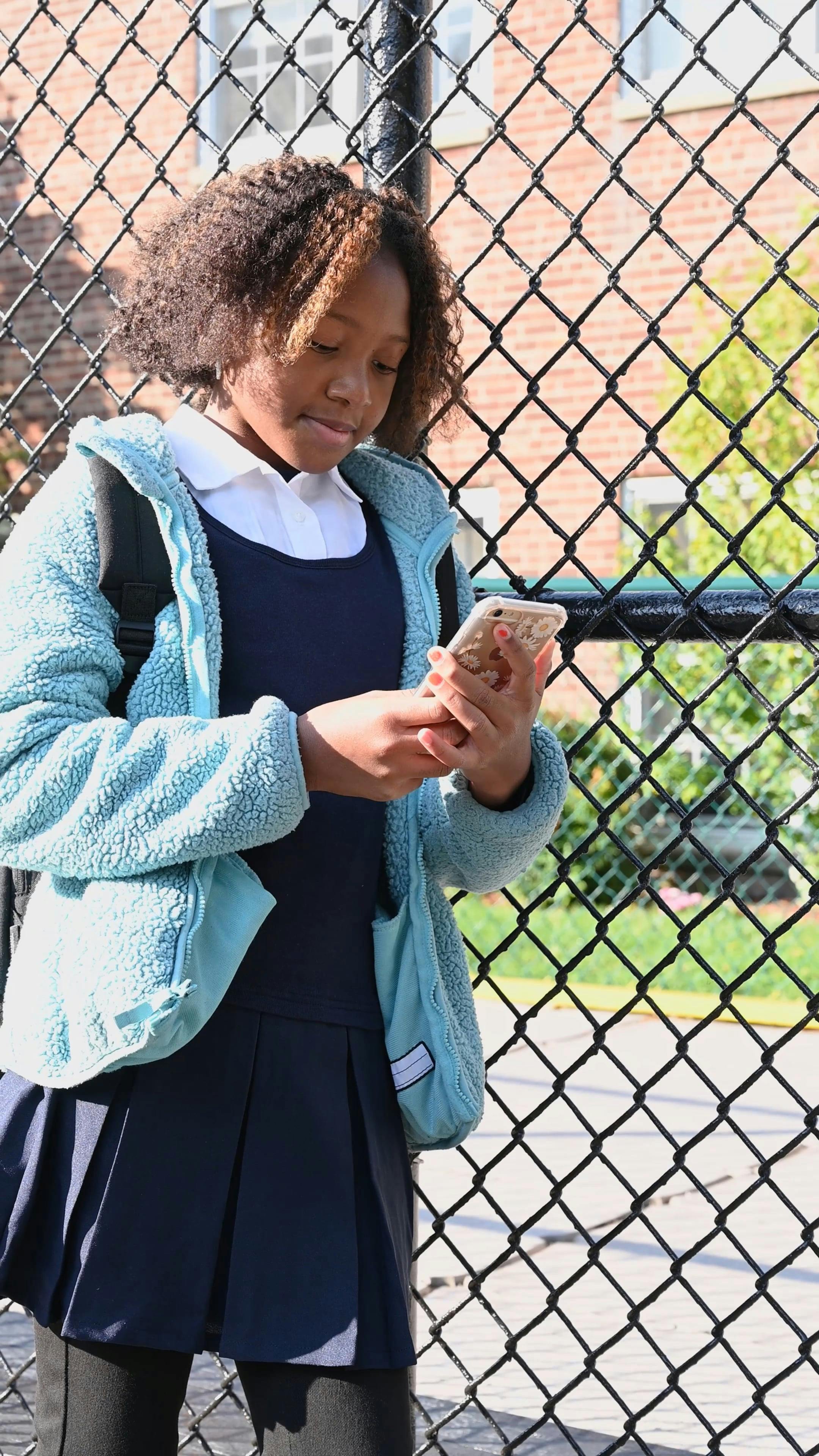 Girl in School Uniform Holding an iPhone Free Stock Video Footage ...