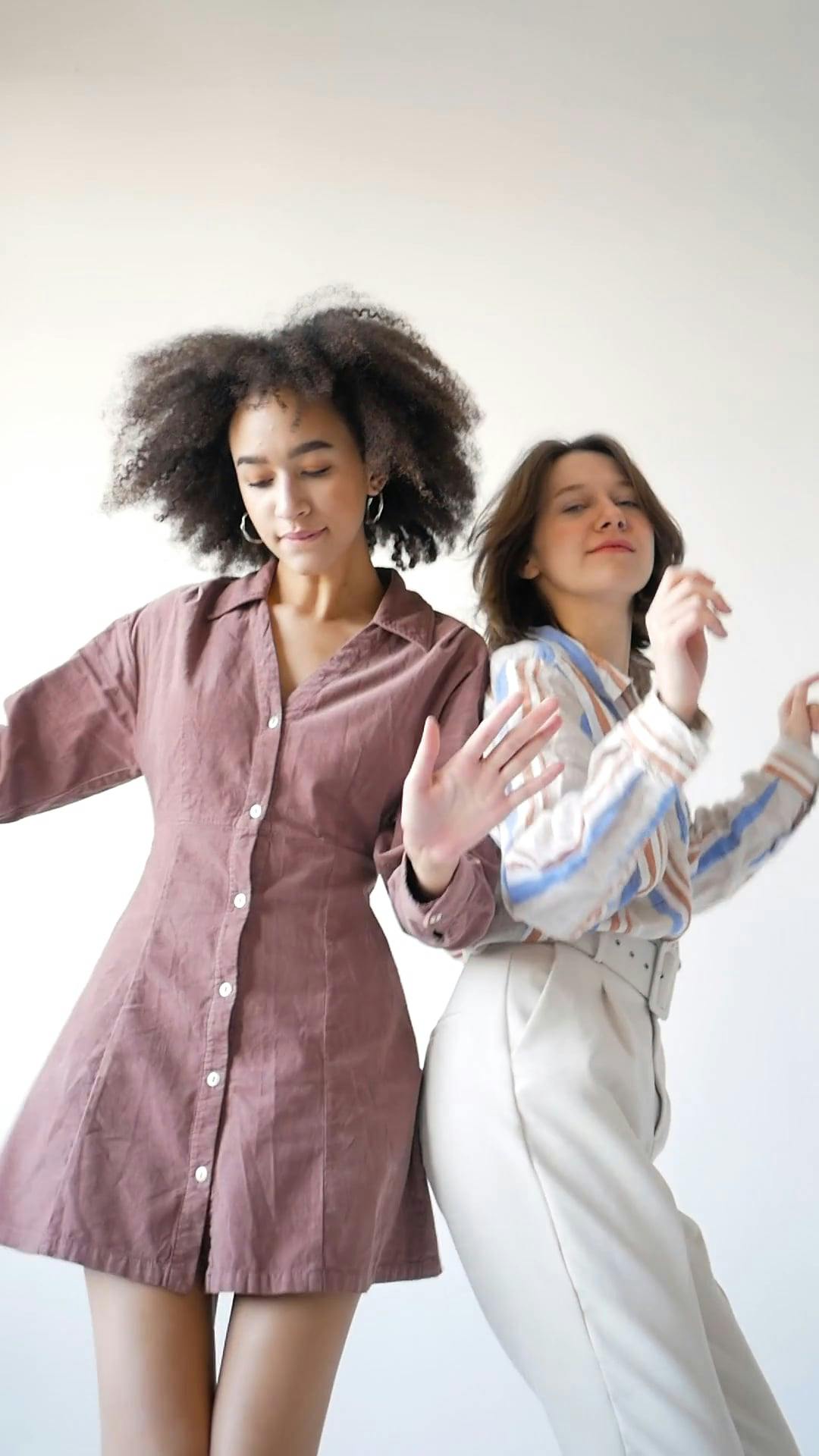 Young Women Dancing Back to Back and Looking at Camera Free Stock Video ...