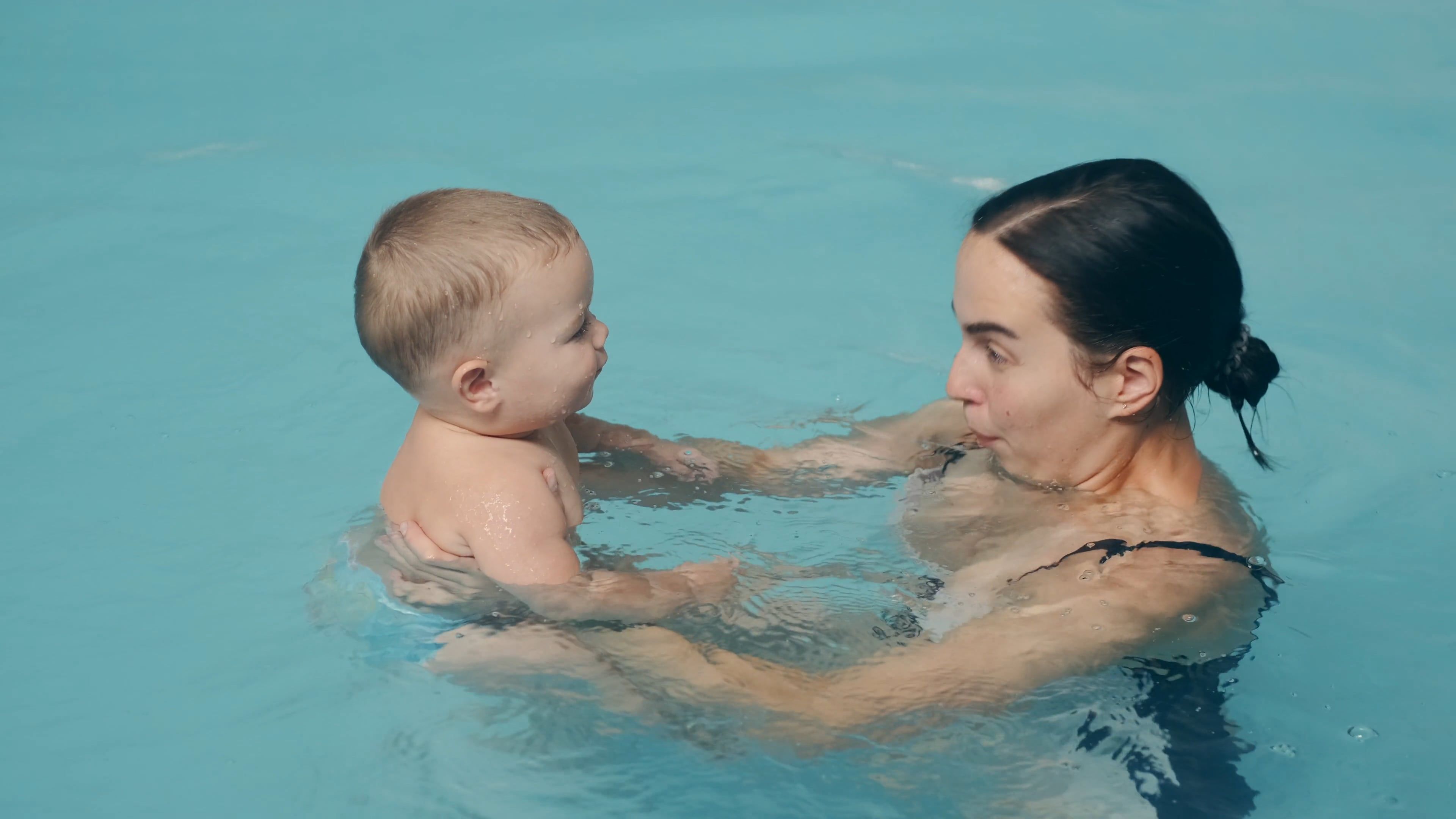 Adult and Baby in the Pool · Free Stock Video