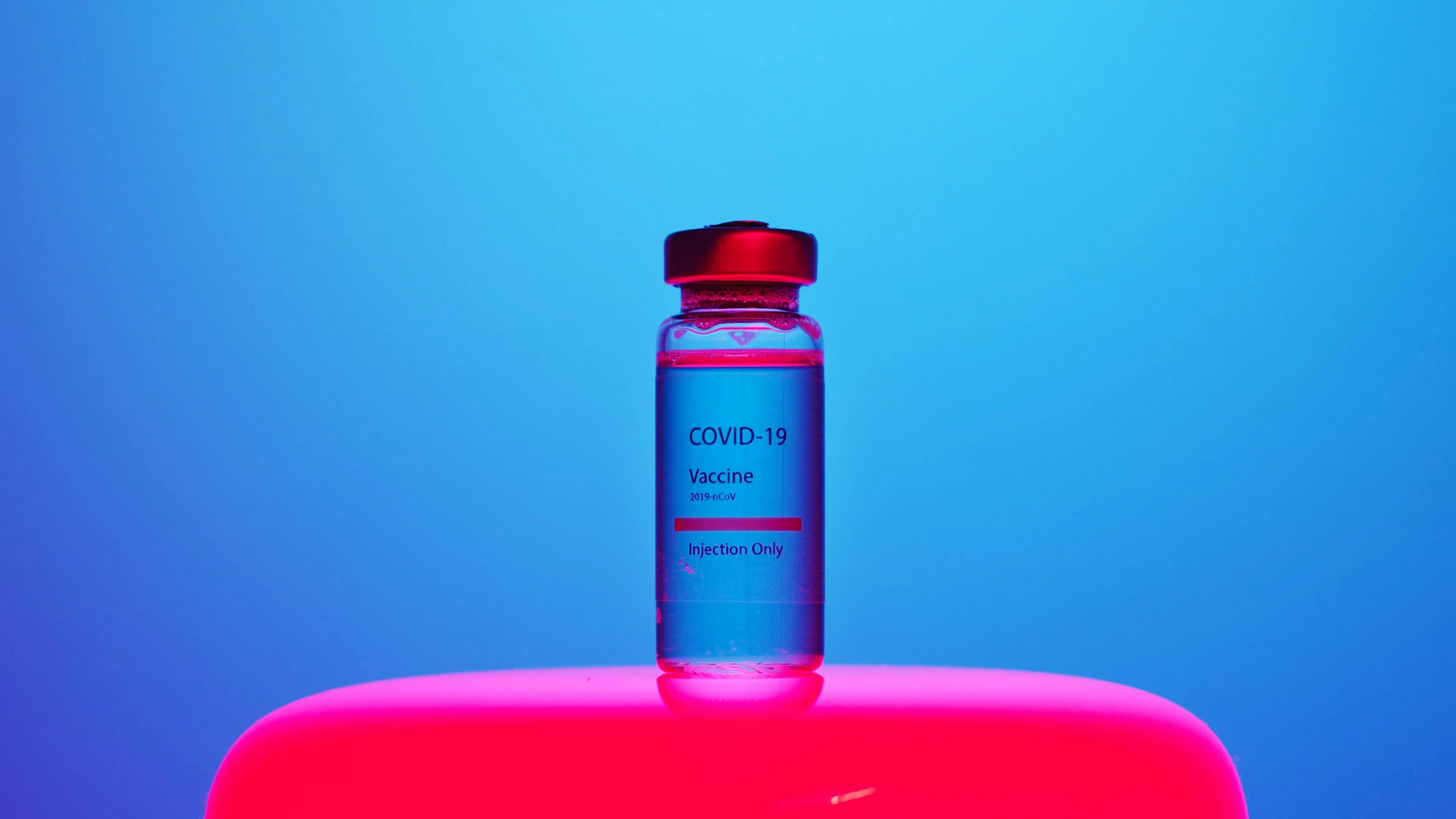 Vaccine Vial on Glowing Colorful Lamp Free Stock Video Footage, Royalty ...