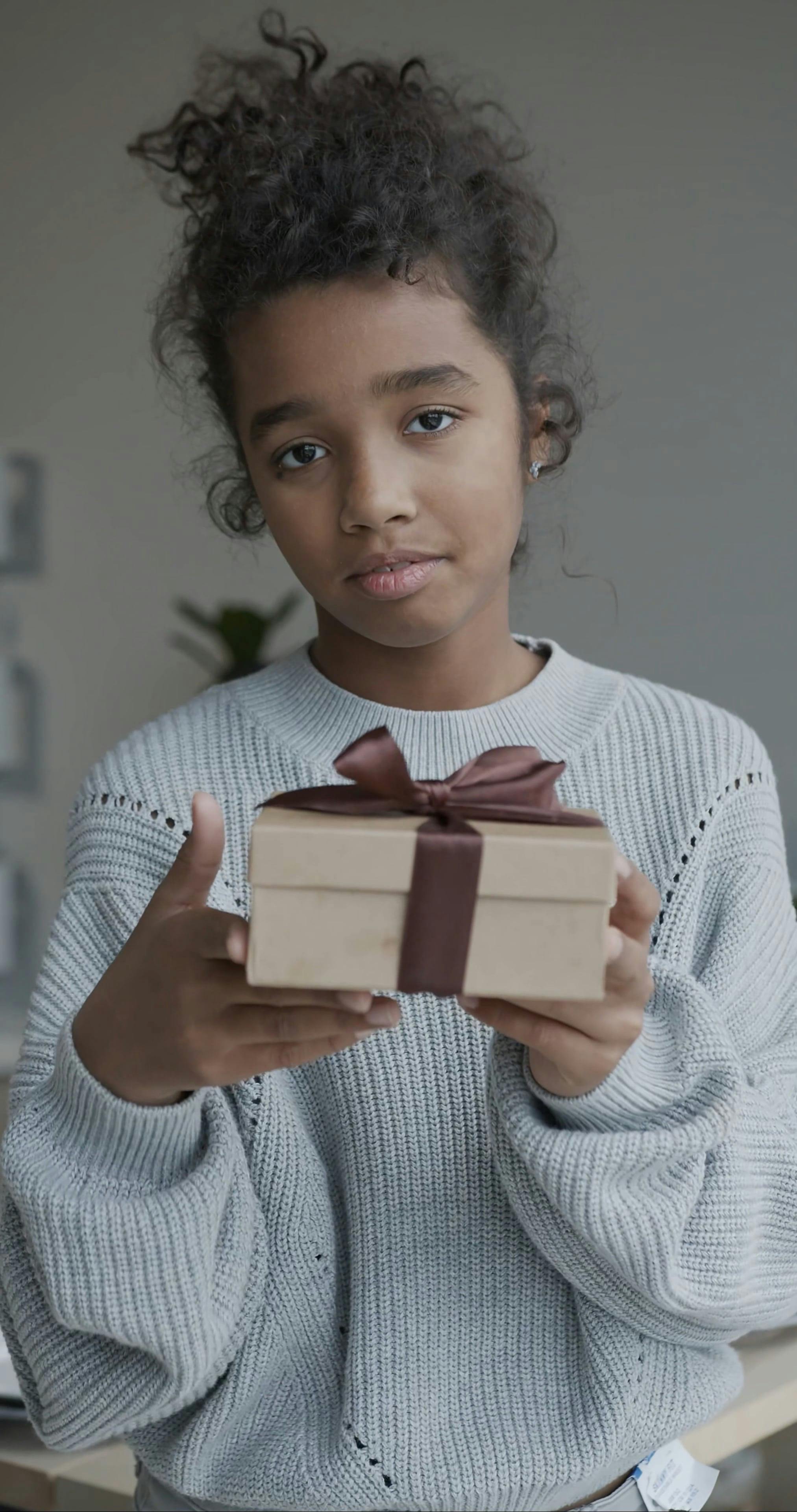 Girl Holding a Gift Box · Free Stock Video