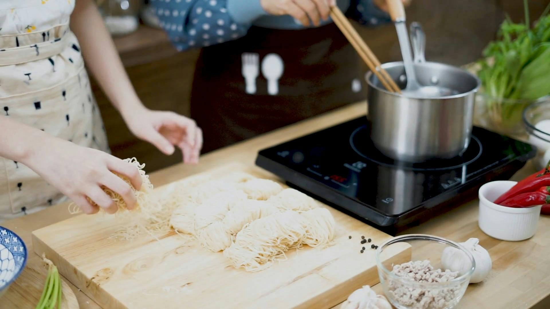 Mom and Daughter Making Noodles · Free Stock Video