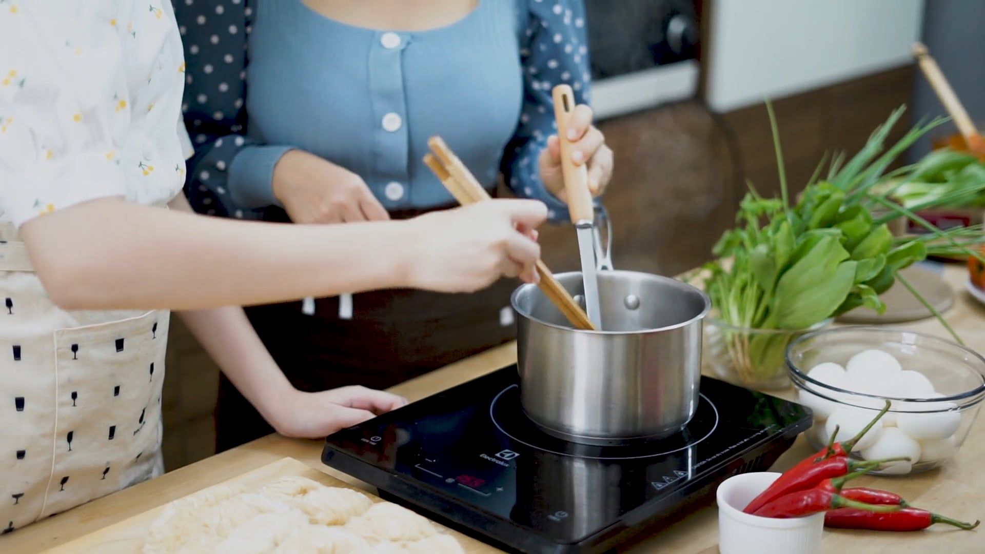 Mom and Daughter Cooking Noodles · Free Stock Video