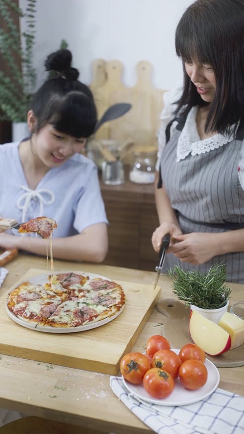 Mom And Daughter Making Pizza · Free Stock Video