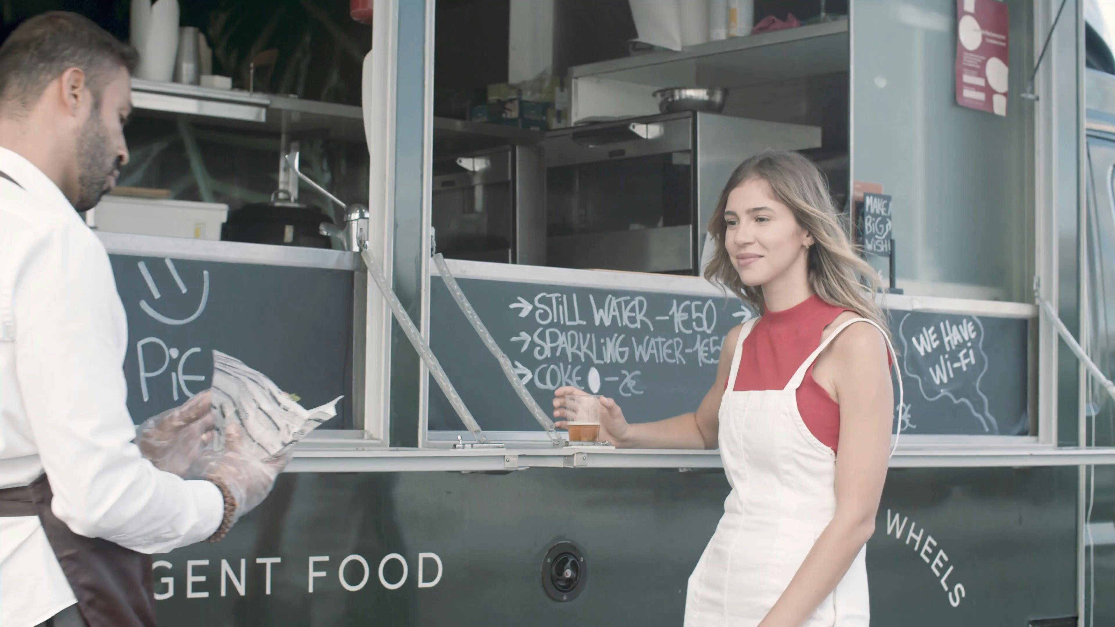 Two People Eating Street Food · Free Stock Video