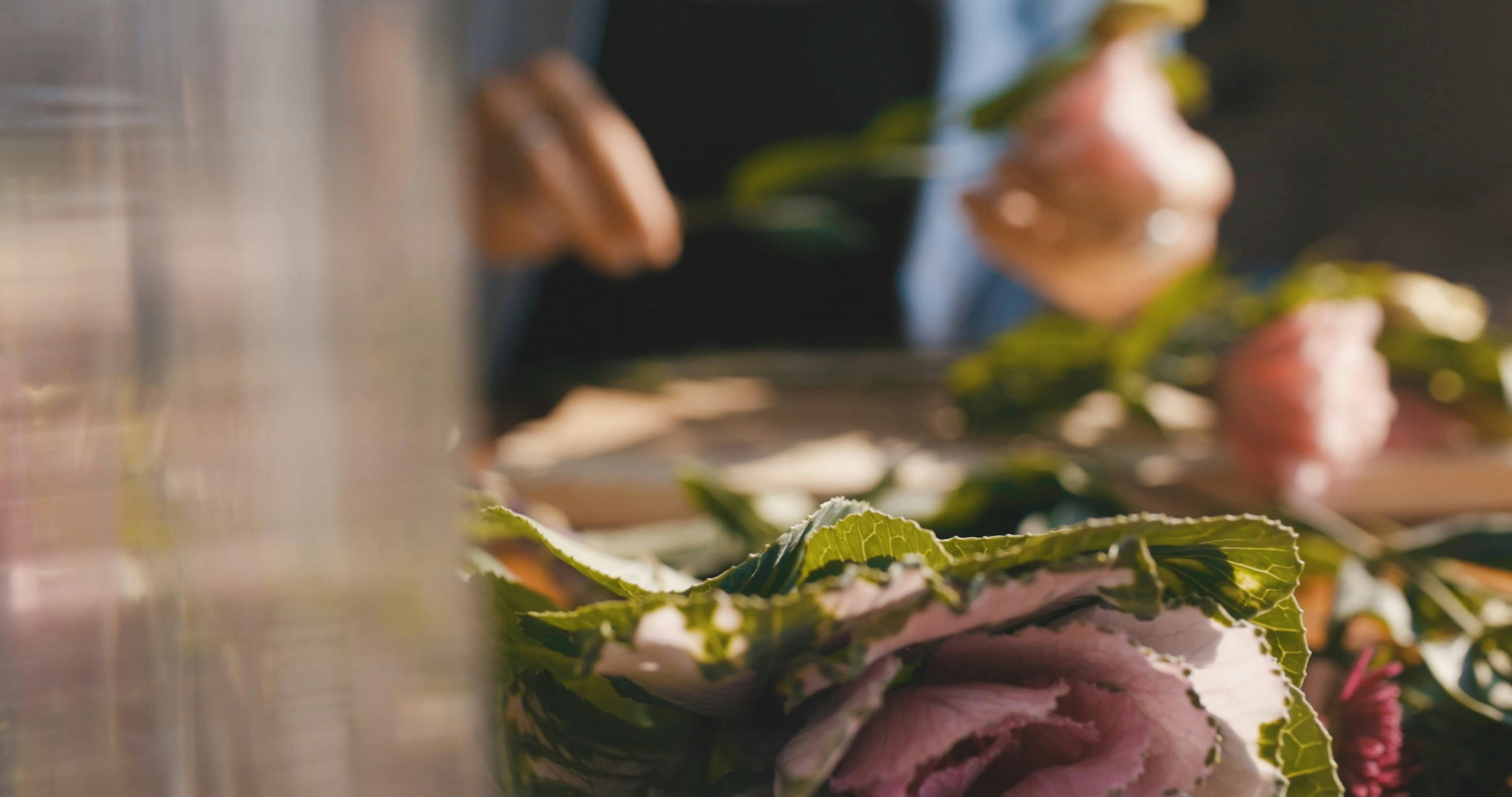 A Woman Florist Setting Up A Flower Arrangement · Free Stock Video