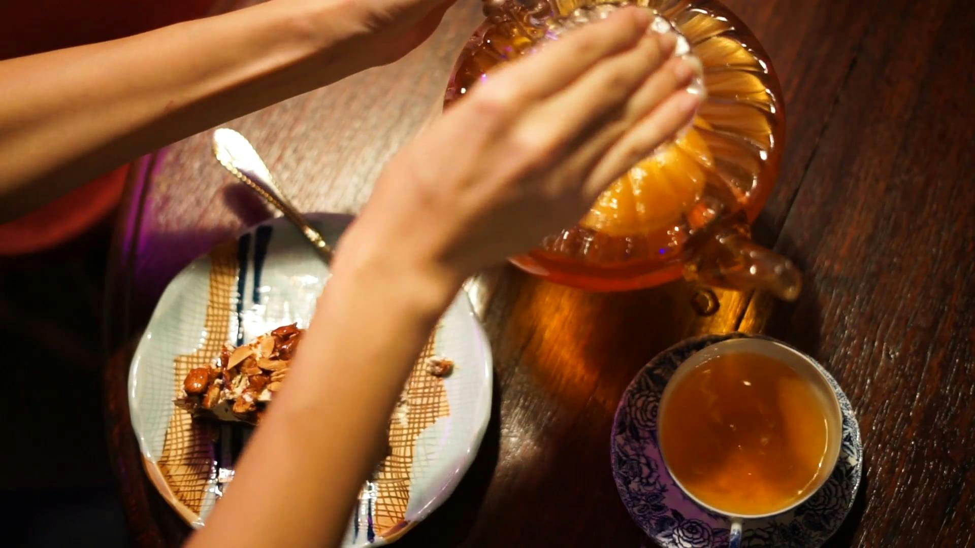 Pouring Tea On Teacup · Free Stock Video