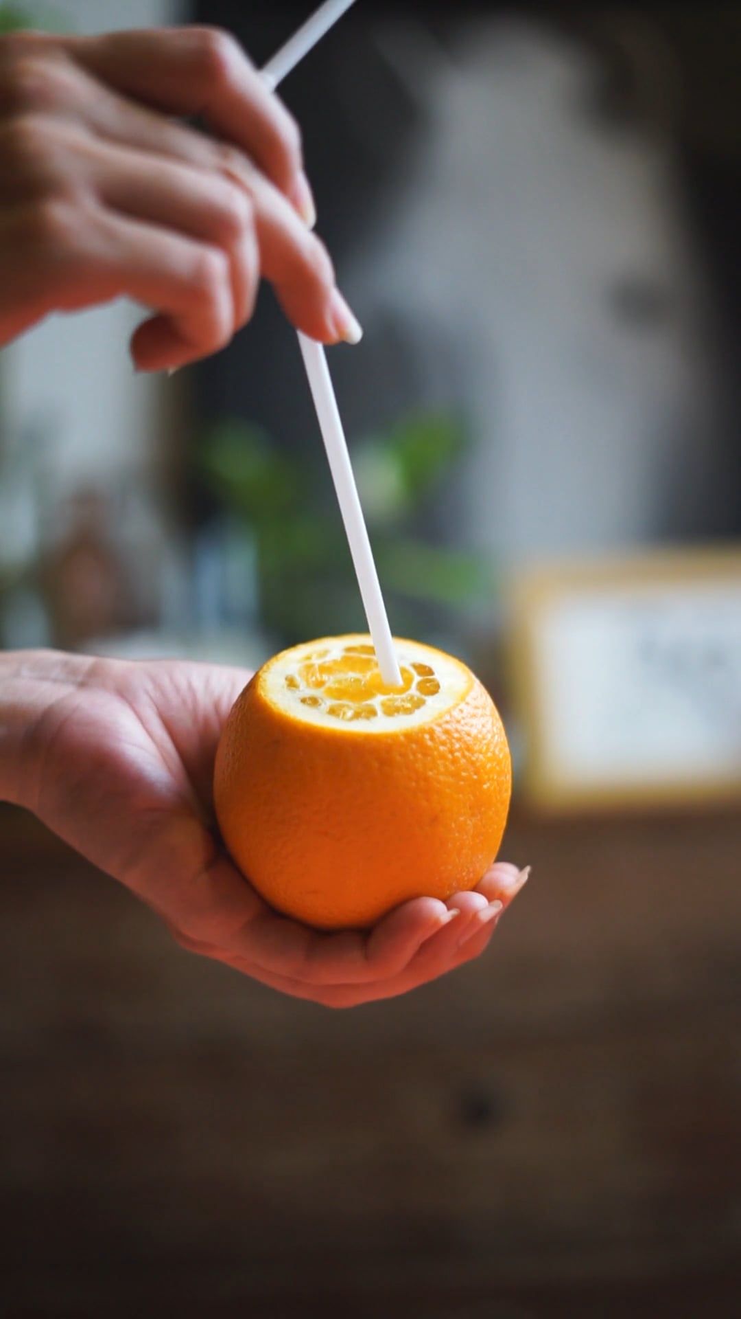 A Person Sticking a Straw in a Sliced Orange Free Stock Video Footage ...