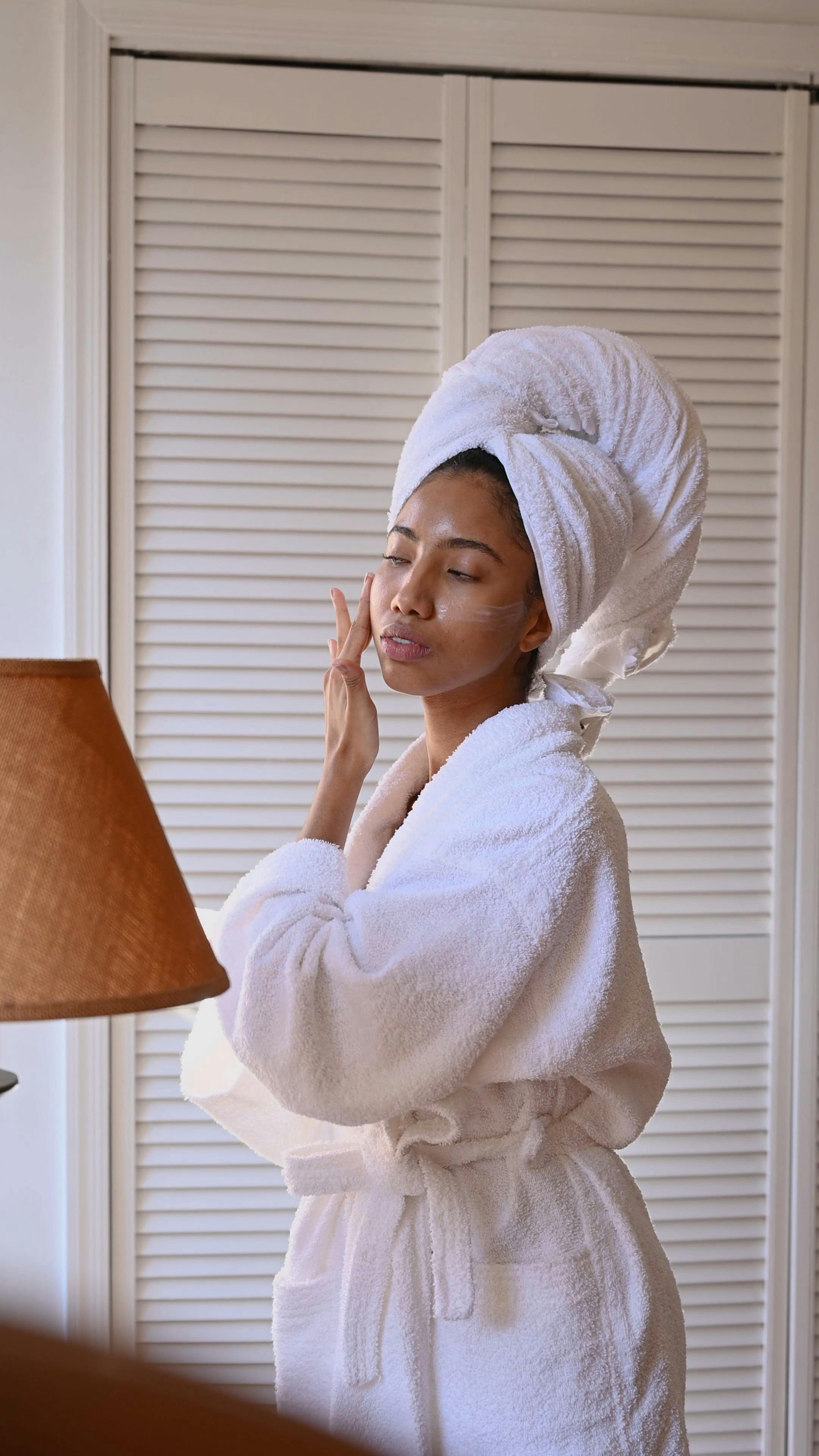 A Woman Putting Skin Care Product on Her Face Free Stock Video Footage ...