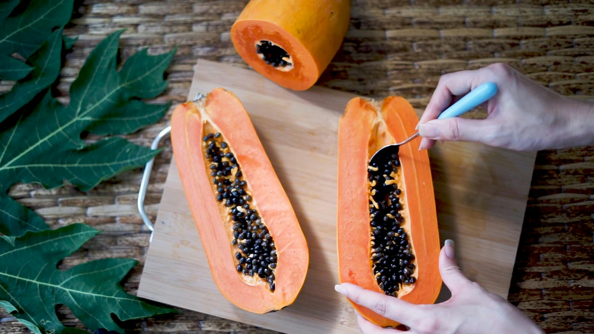Person Removing Seeds From a Papaya Fruit Free Stock Video Footage ...