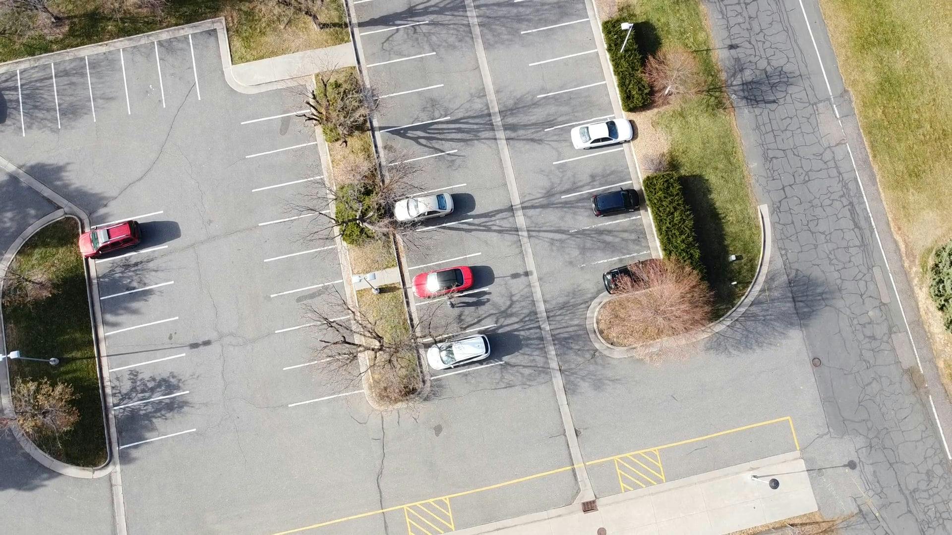 Drone Footage of Cars Parked and Driving in Parking Lot of the Mall ...