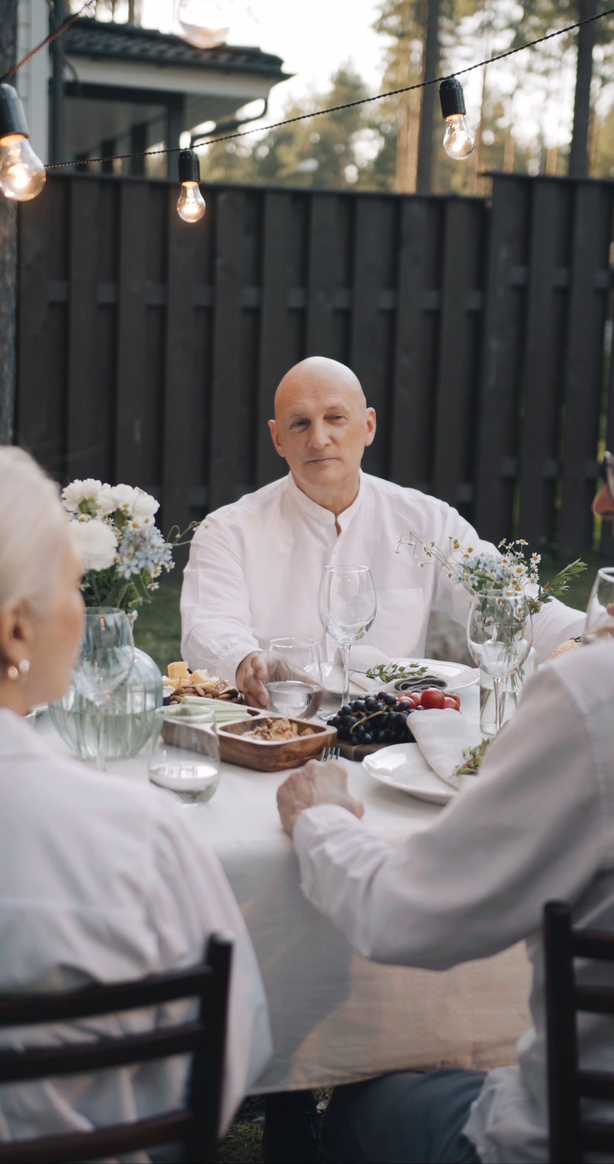 Elderly Friends Eating Dinner Outdoors while Celebrating an Event ...
