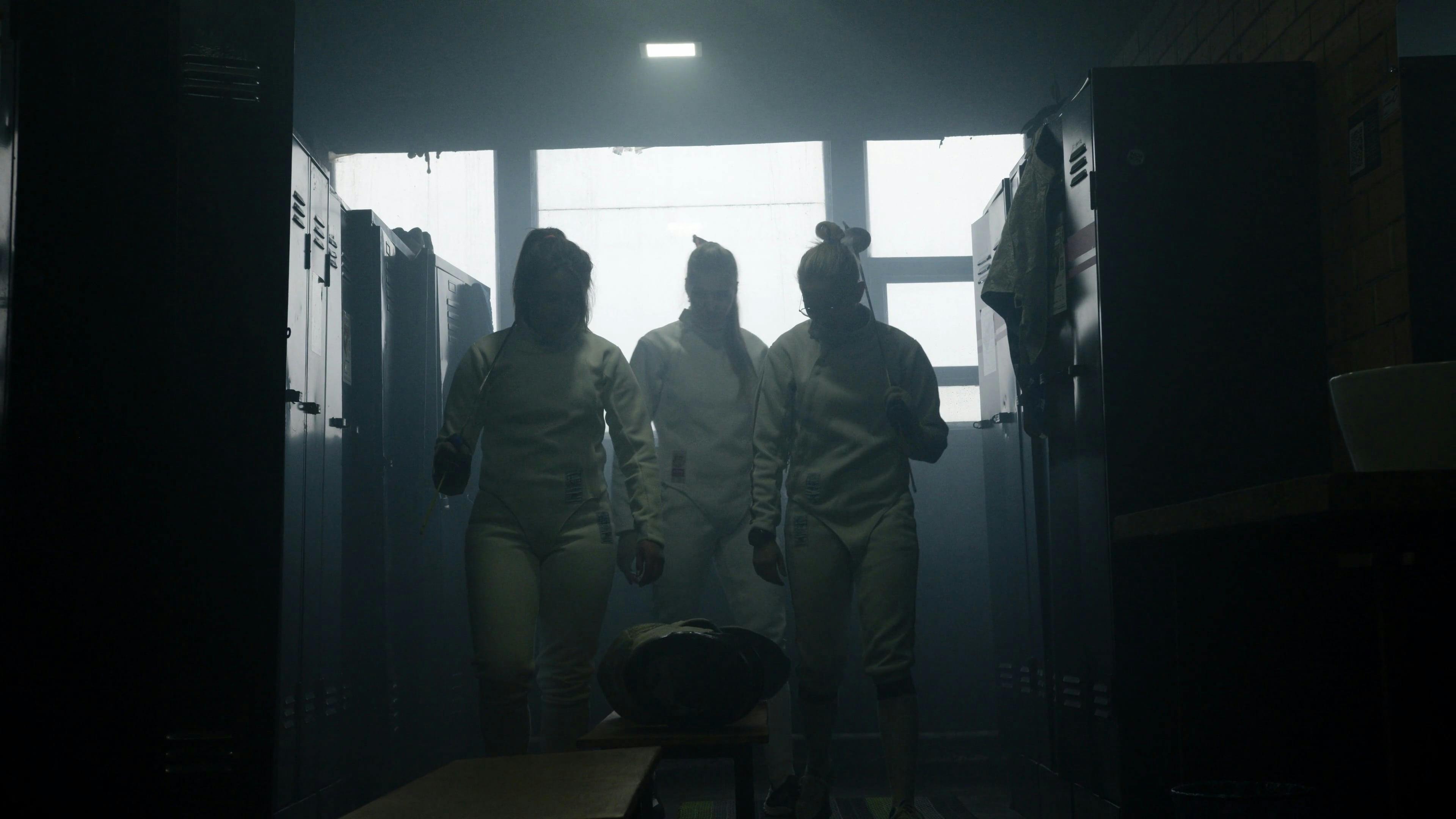 Three Women Wearing Fencing Attire Going Outside the Locker While ...