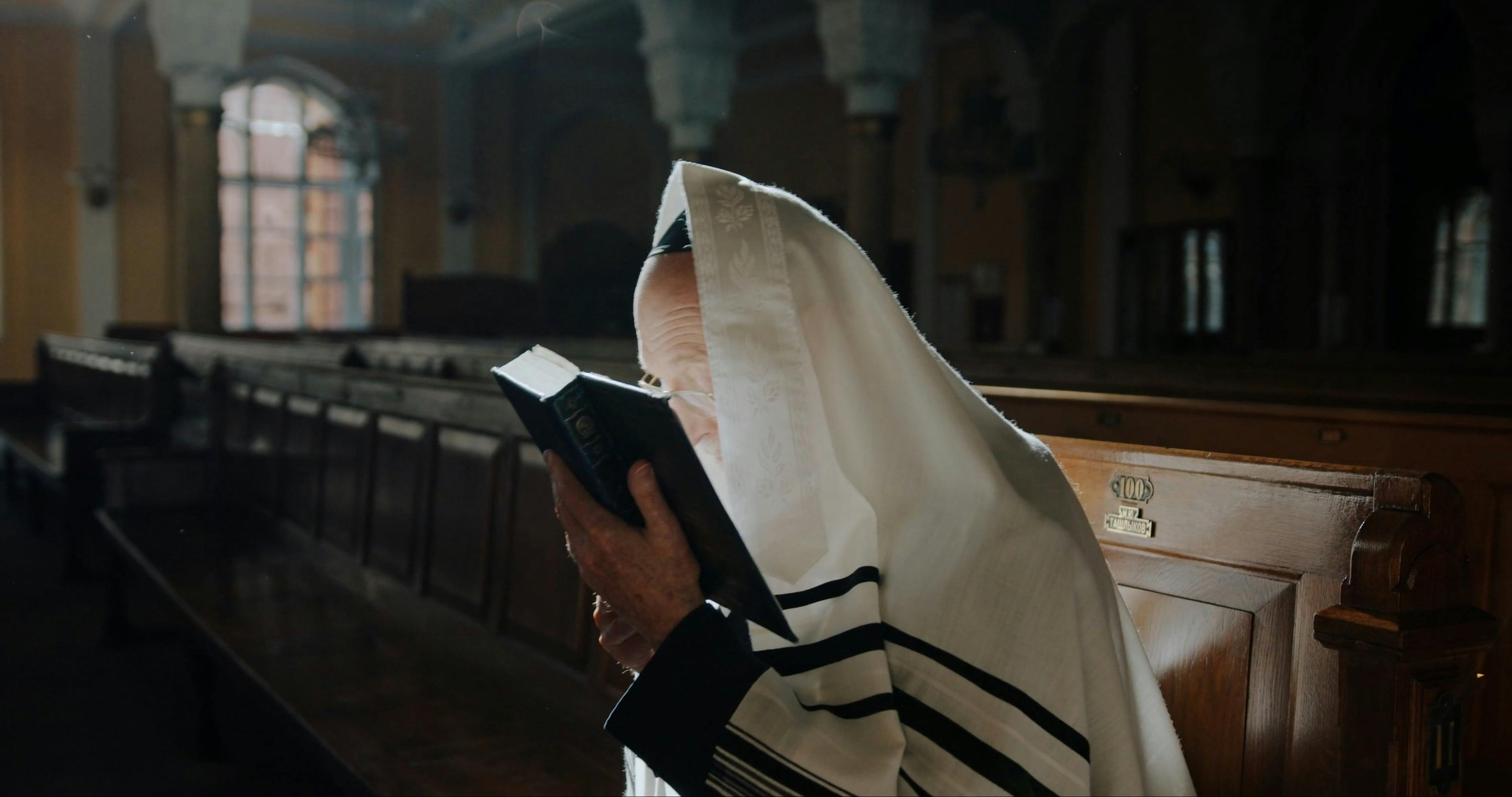 A Man Sitting Inside a Church While Reading a Bible · Free Stock Video