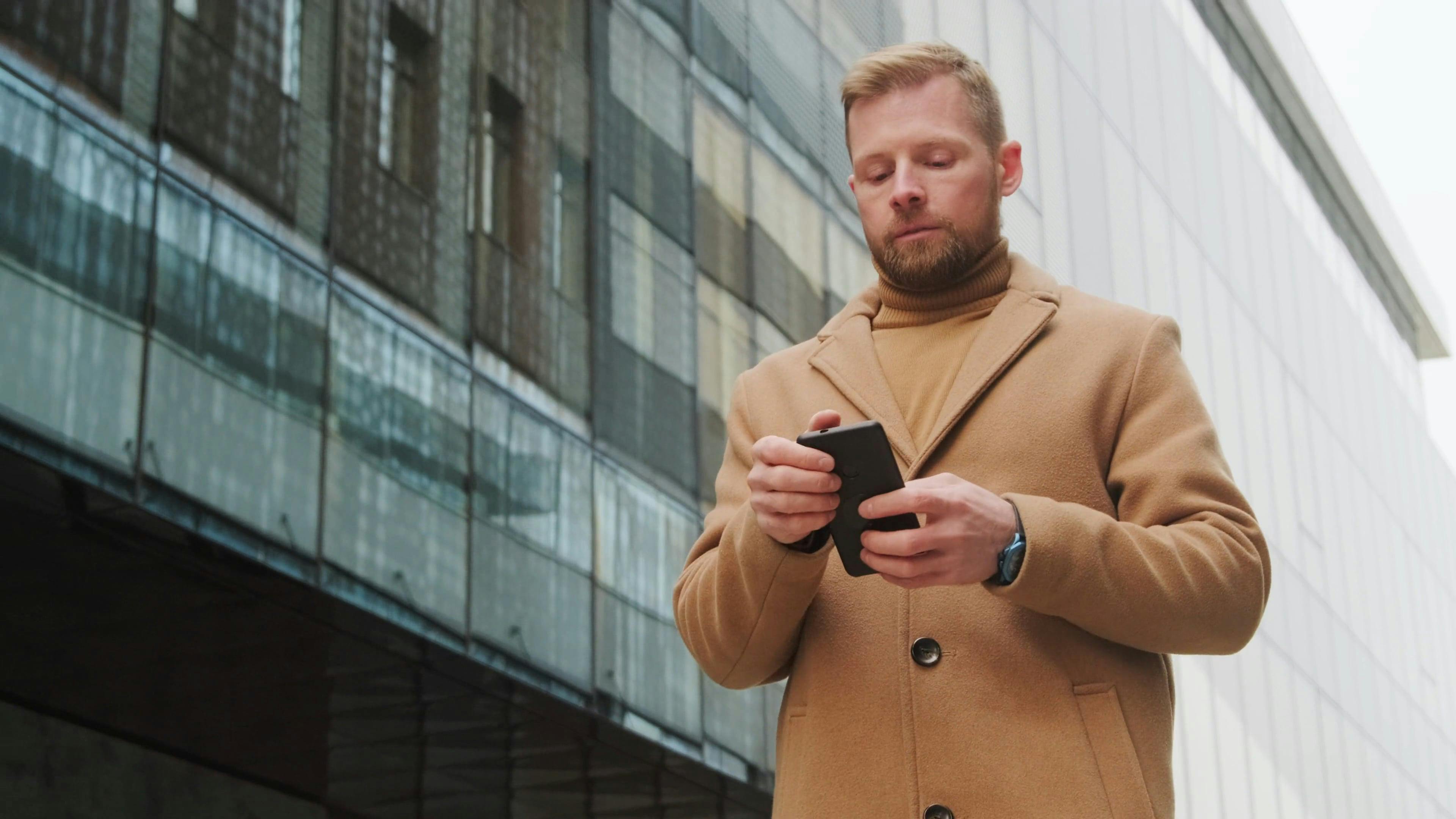 A Man Walking While Using His Smartphone Free Stock Video Footage ...