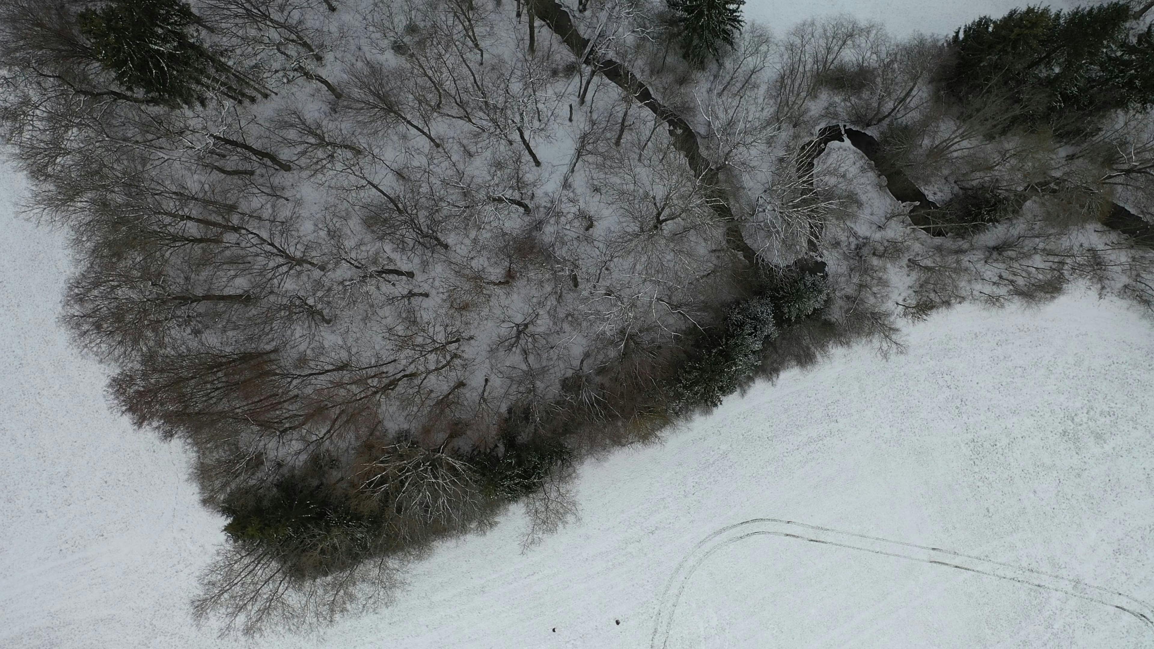 Aerial View of the Snow Covered Road on a Mountain Side · Free Stock Video