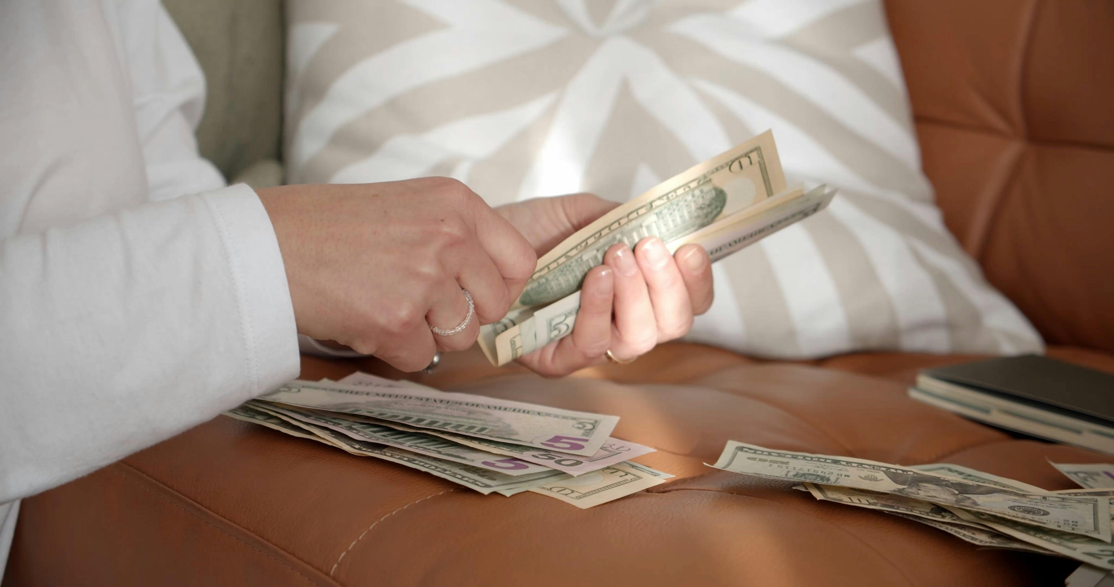 A Person Counting Her Money · Free Stock Video