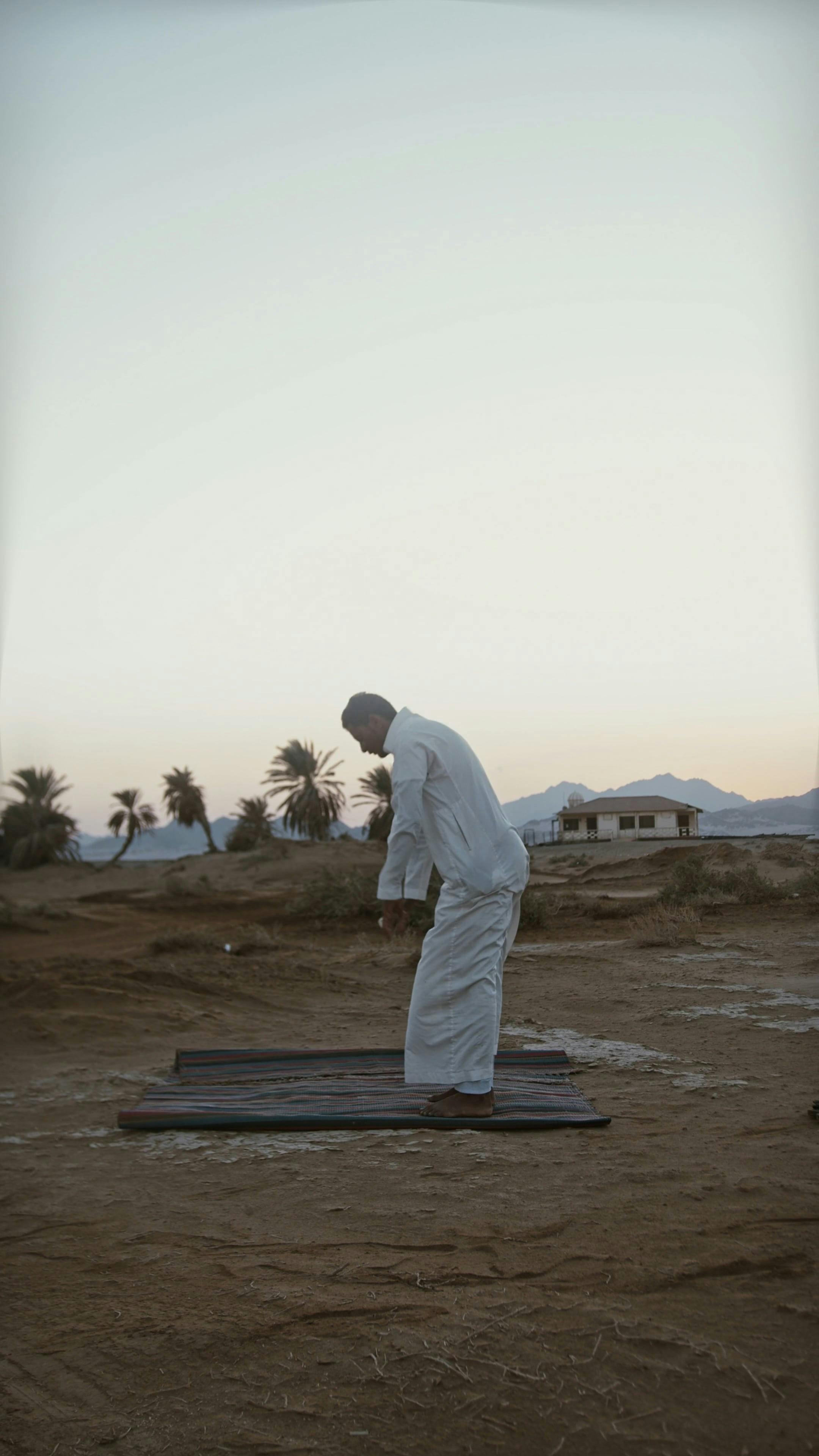 A Man Bowing Down in the Middle of the Desert Free Stock Video Footage ...