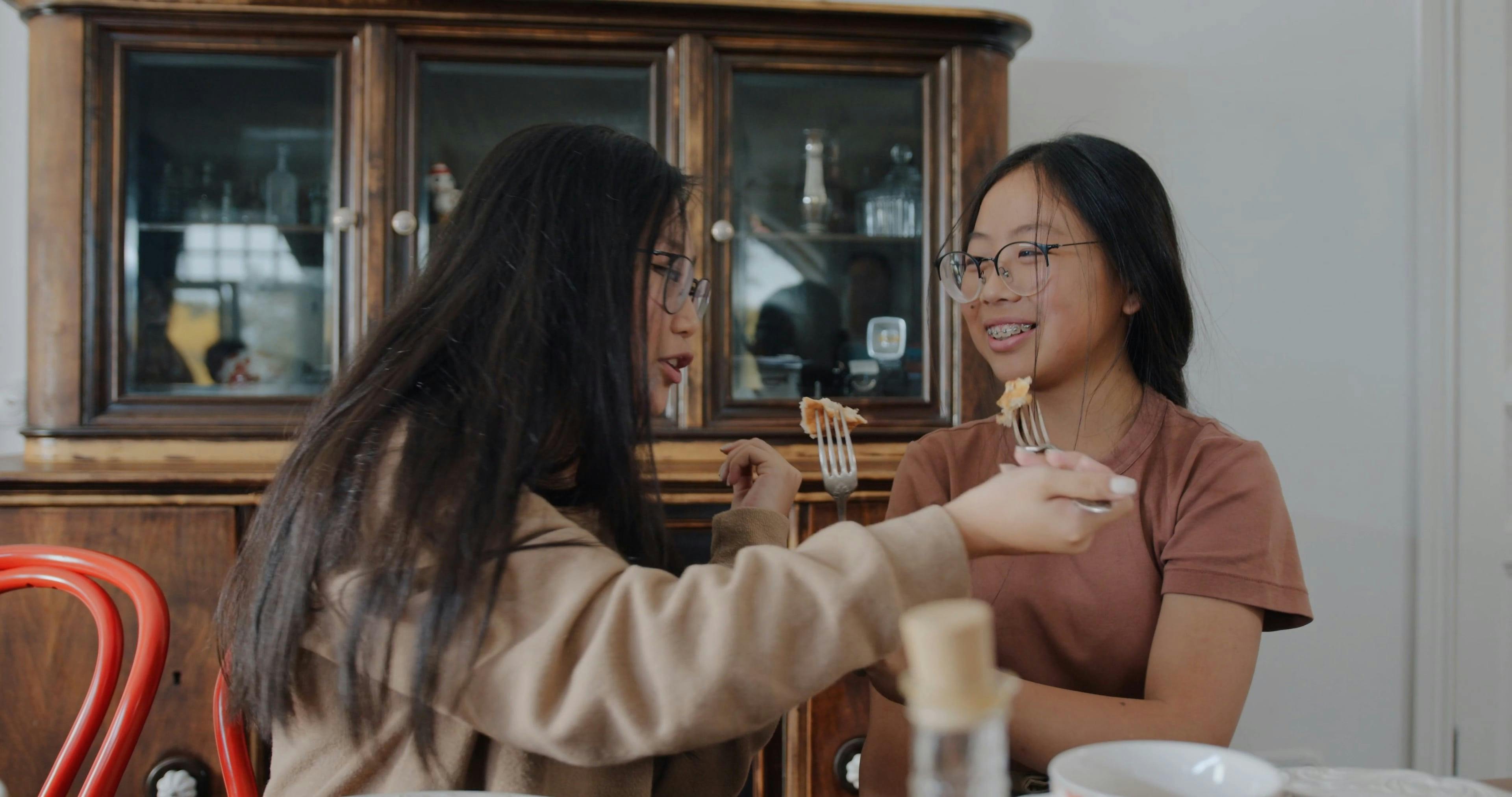 Two Cheerful Teenage Girls Feeding Each Other Free Stock Video Footage ...