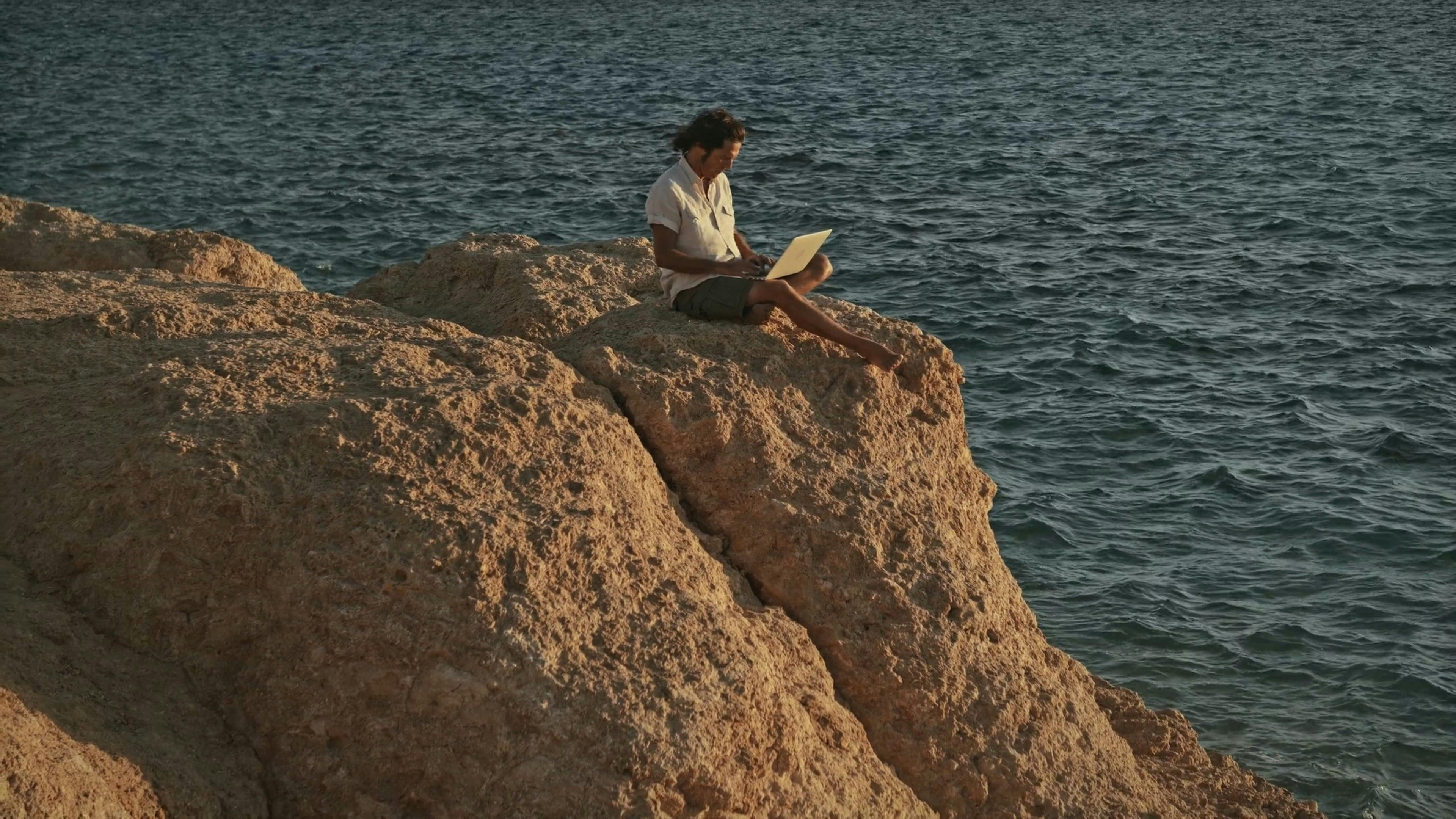 A Man Using a Laptop Over The Cliff Coast Free Stock Video Footage ...