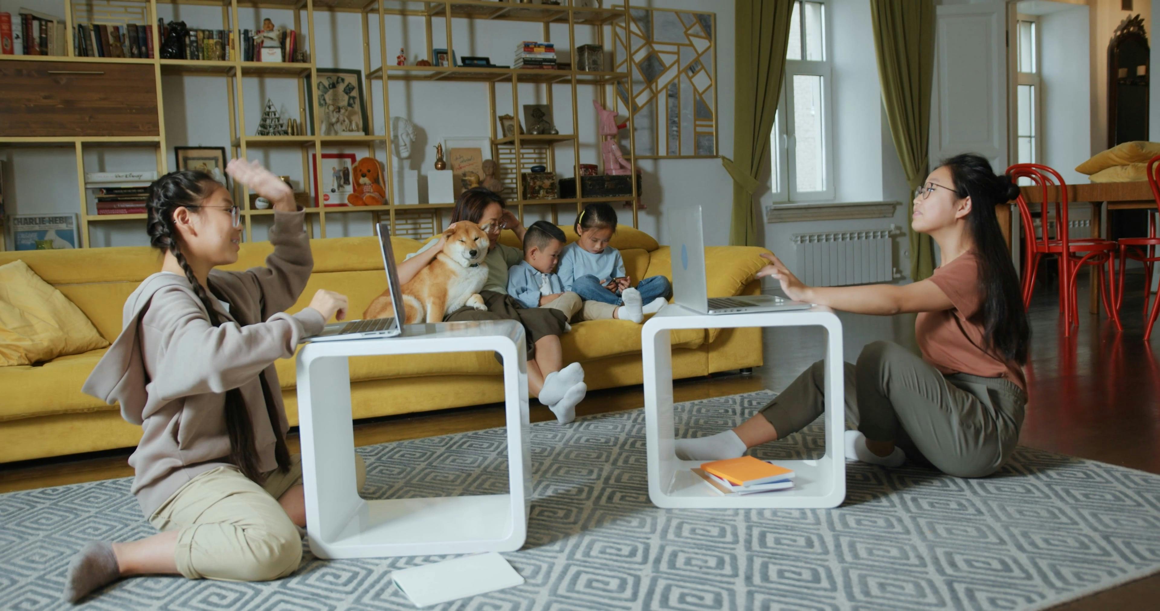 Sisters Talking to Each Other While Looking at a Laptop Free Stock ...