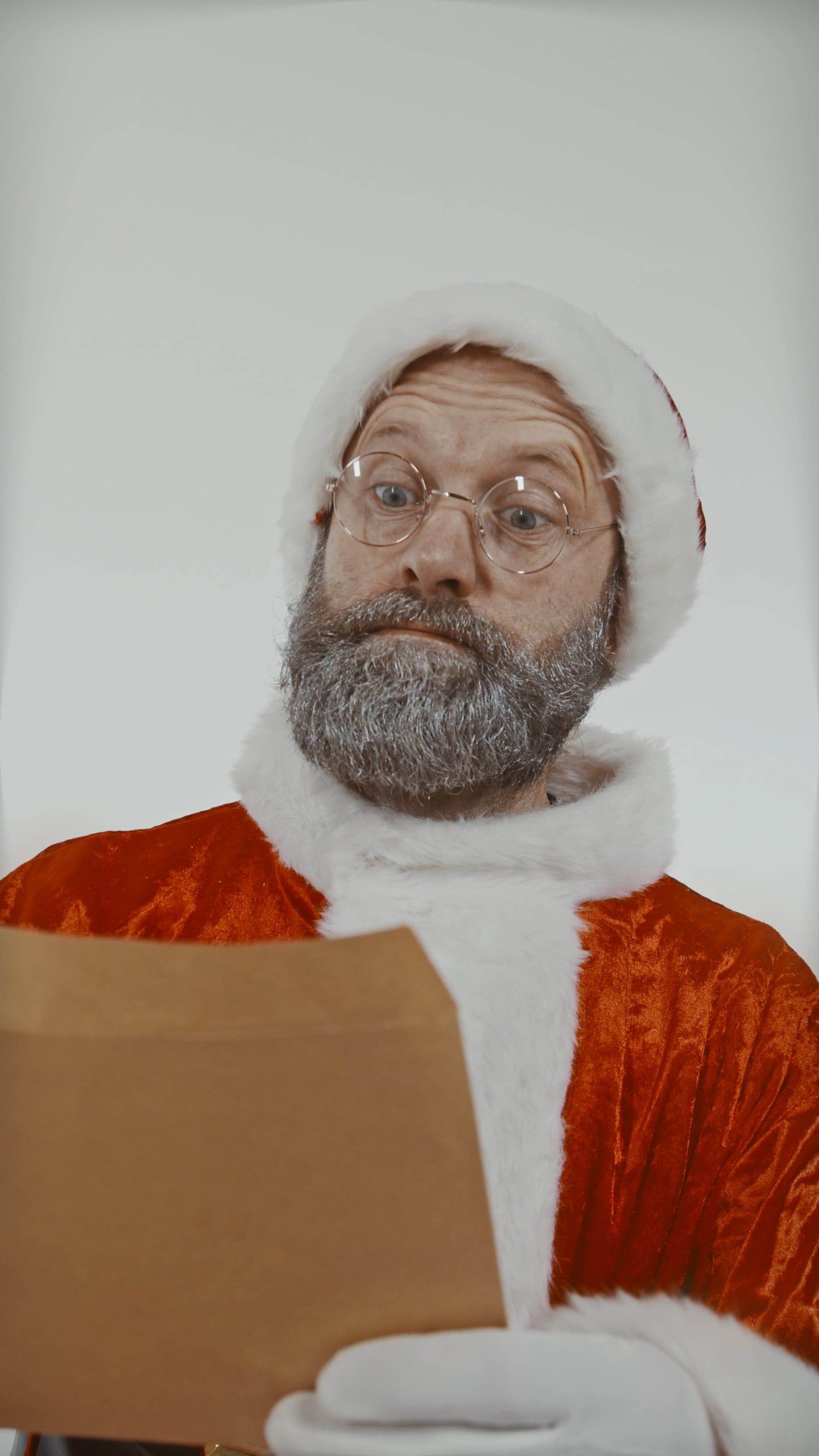 Man in Santa Claus Costume Opening Letter · Free Stock Video