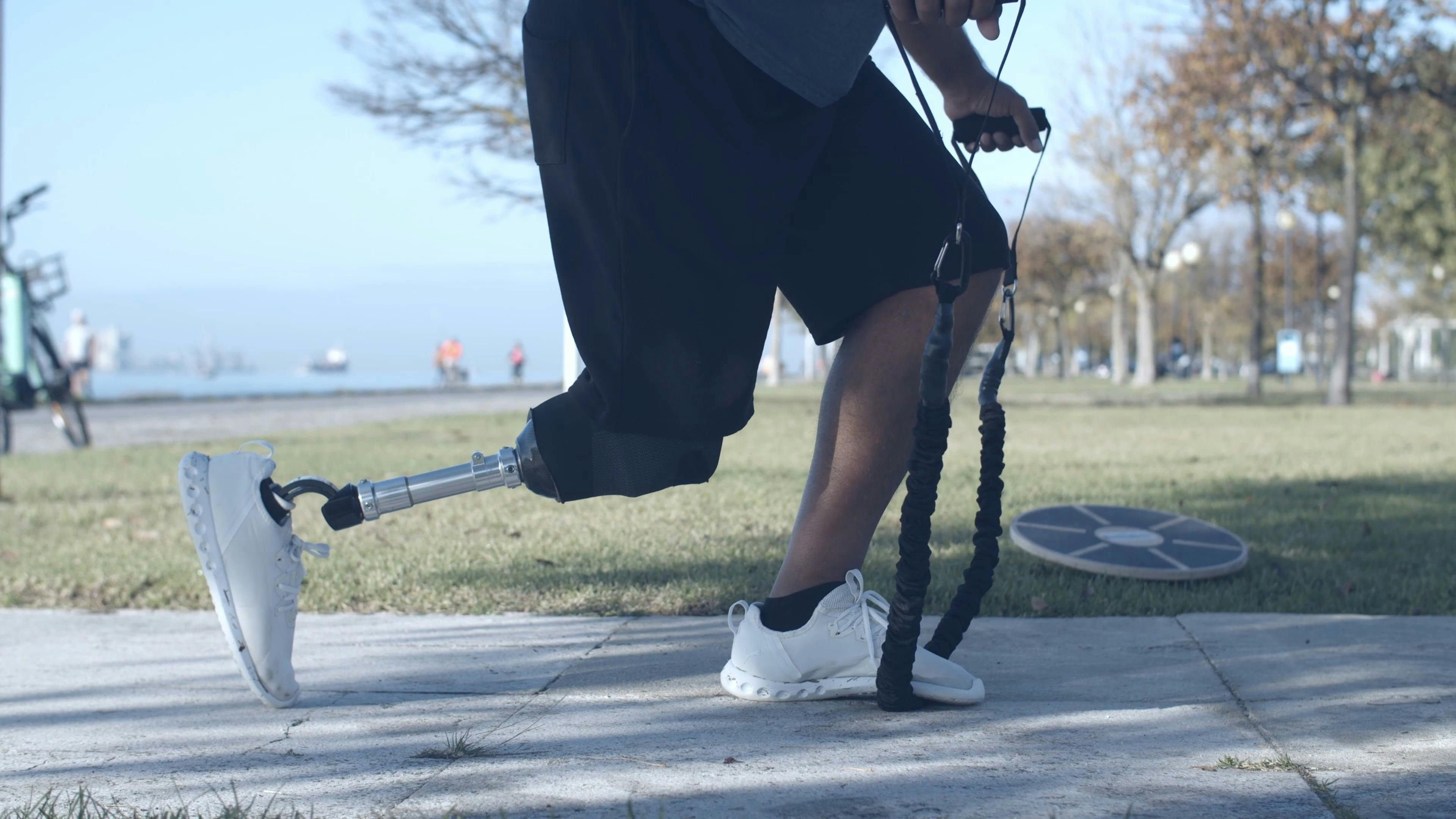 Man with a Prosthetic Leg Using a Stretch Rope Free Stock Video Footage ...