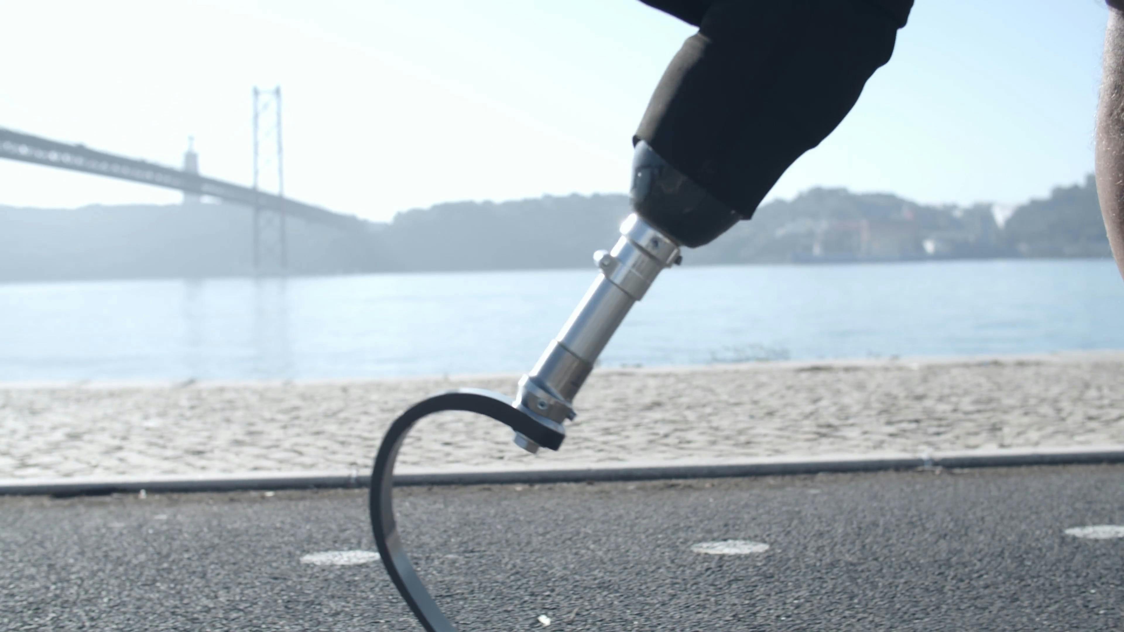 Low Angle View of a Man Jogging Outdoors · Free Stock Video