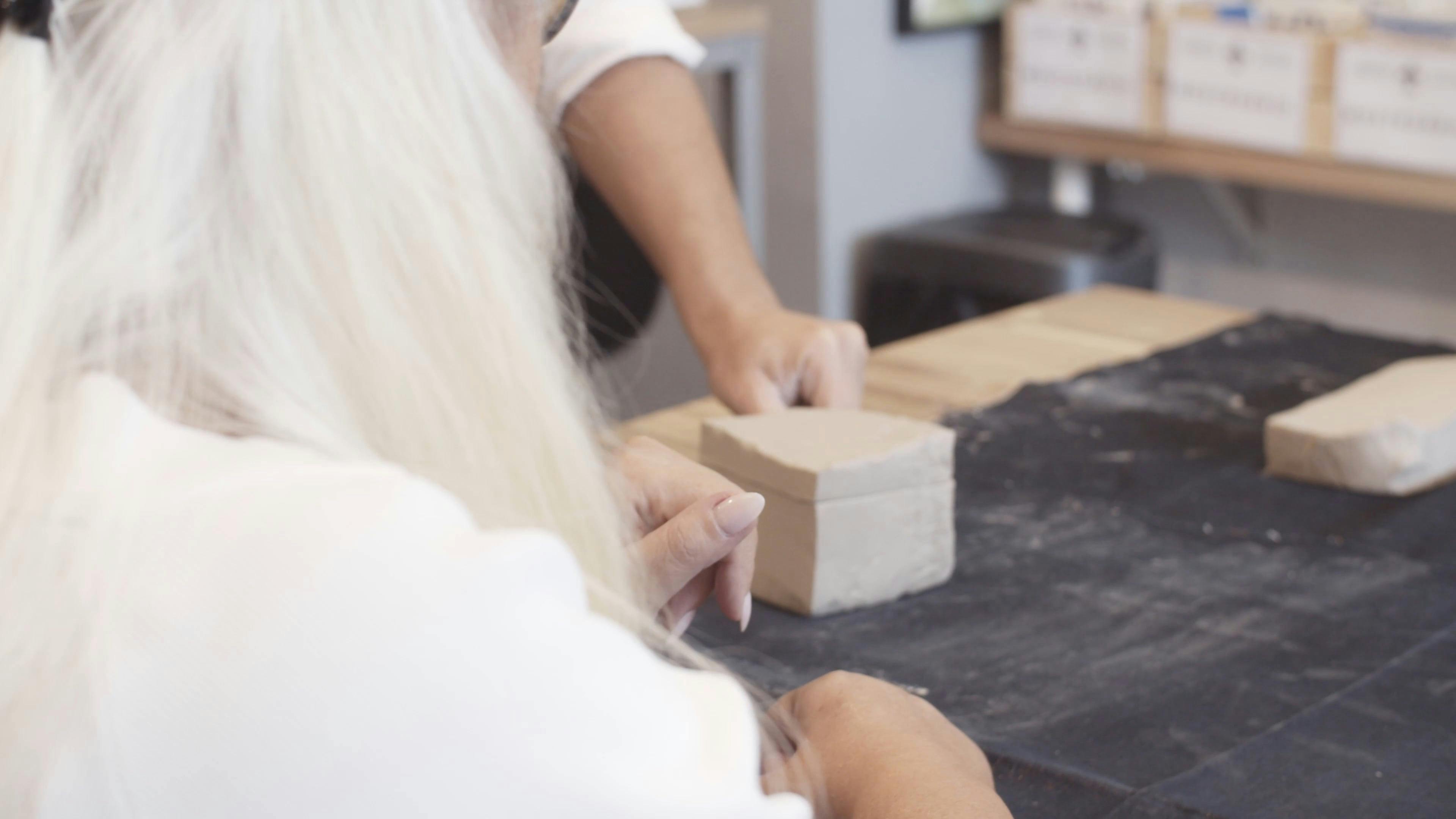 Using a String to Cut Through Clay for Pottery · Free Stock Video
