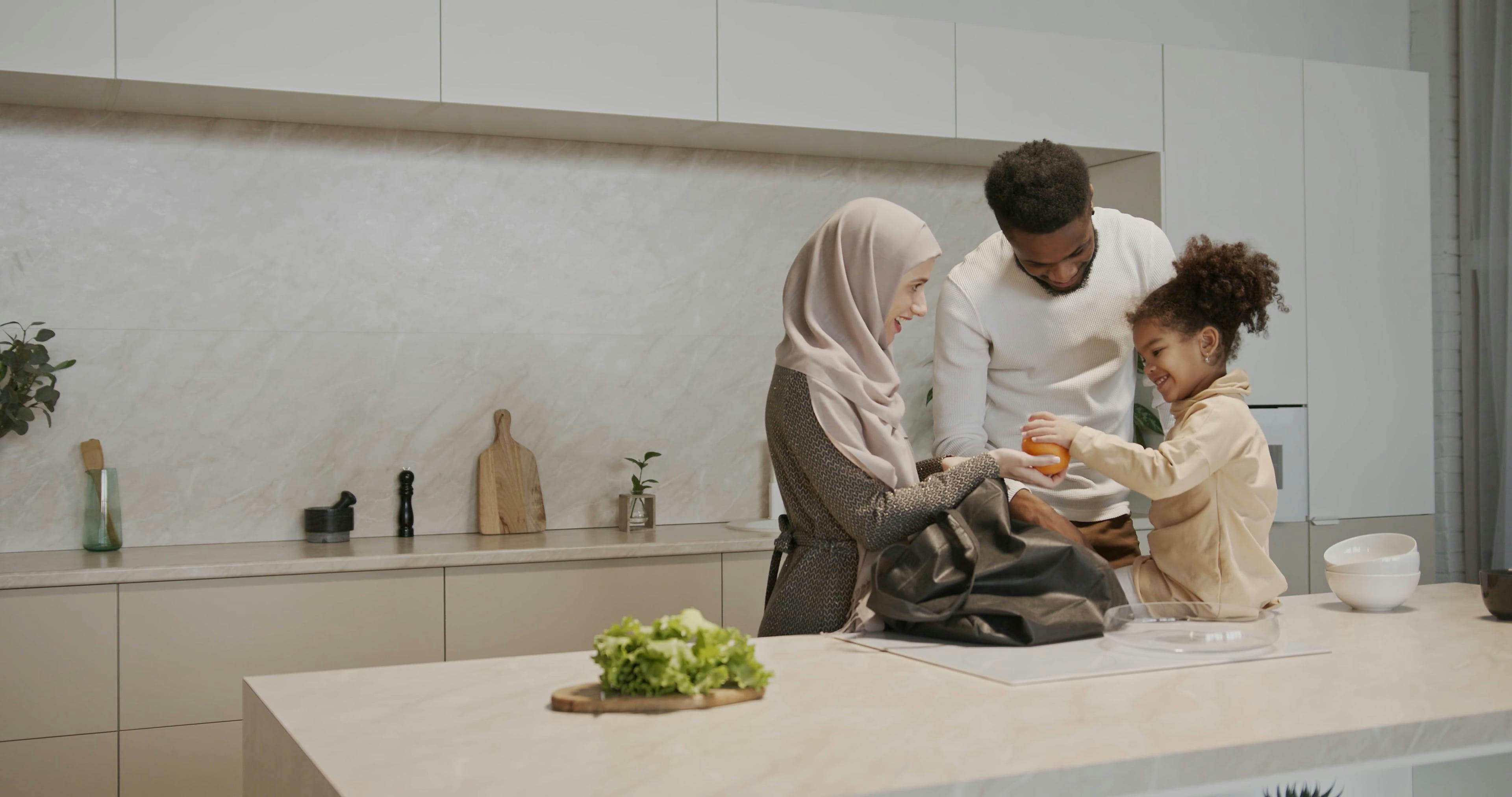 Parents and Child Unpacking Groceries Bag · Free Stock Video