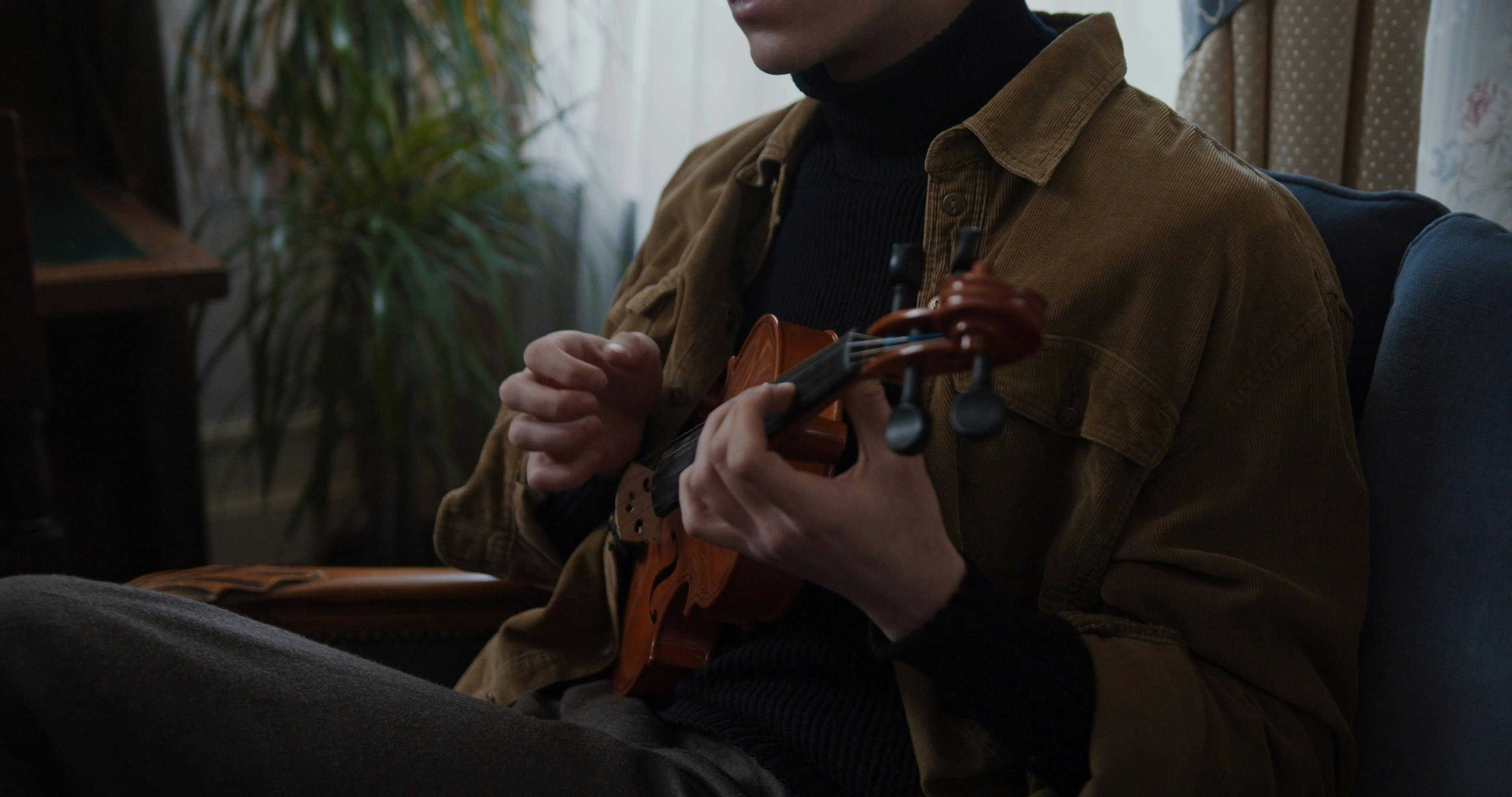 A Man Playing Fiddle while Sitting Free Stock Video Footage, Royalty ...