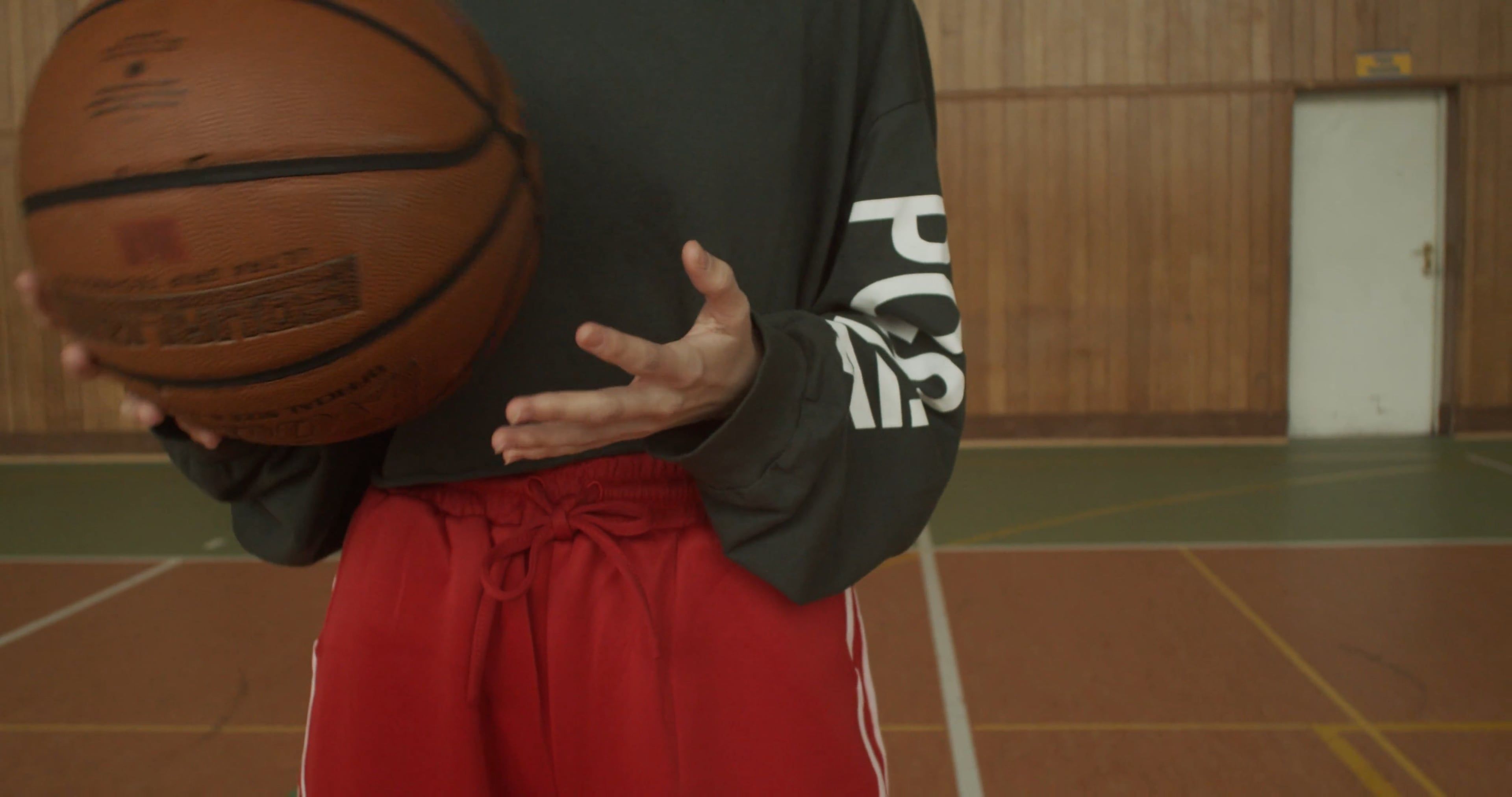 Faceless Person Spinning Basketball Near a Retro Stereo Free Stock ...
