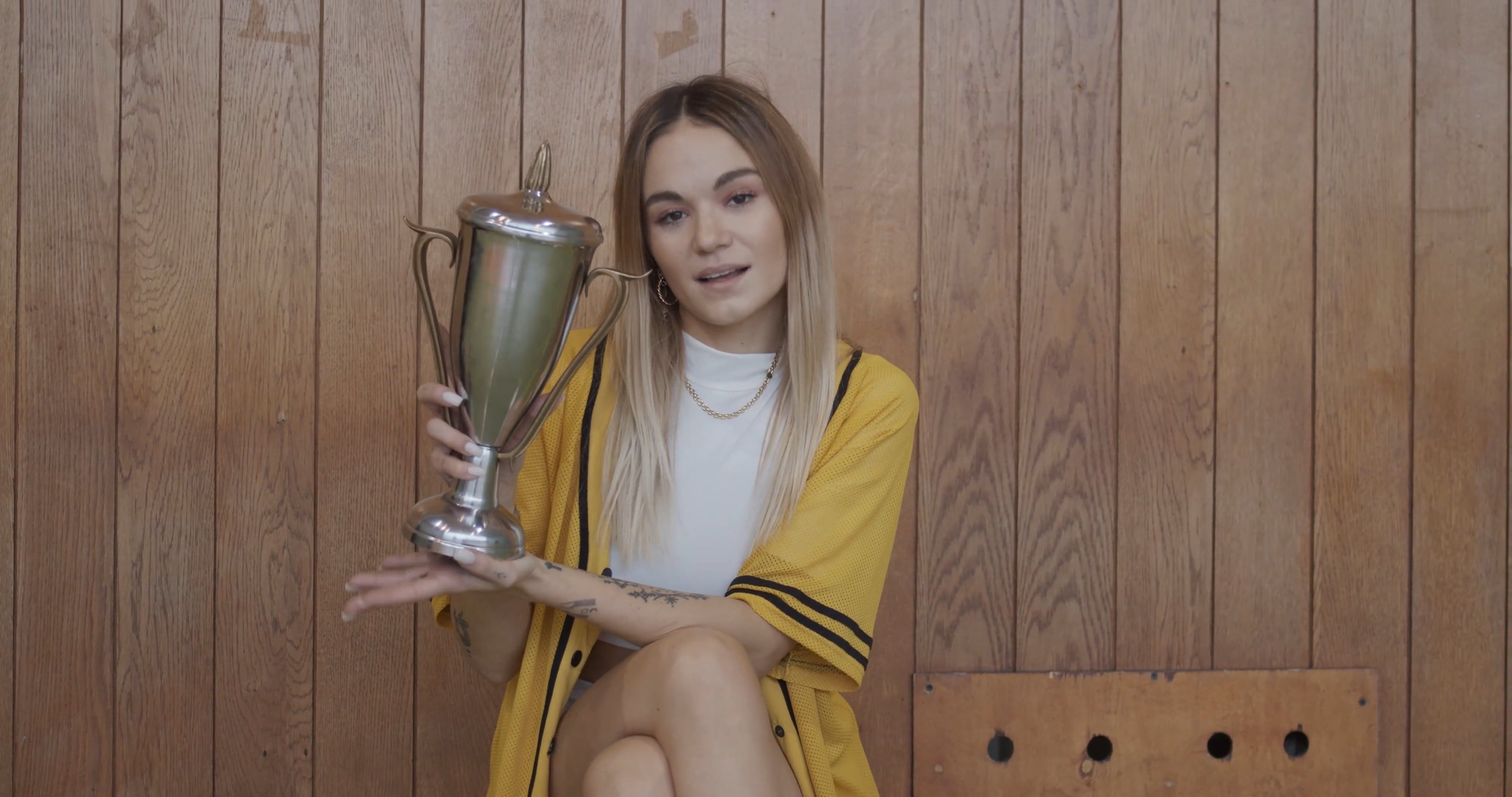 A Woman Posing While Holding a Trophy · Free Stock Video