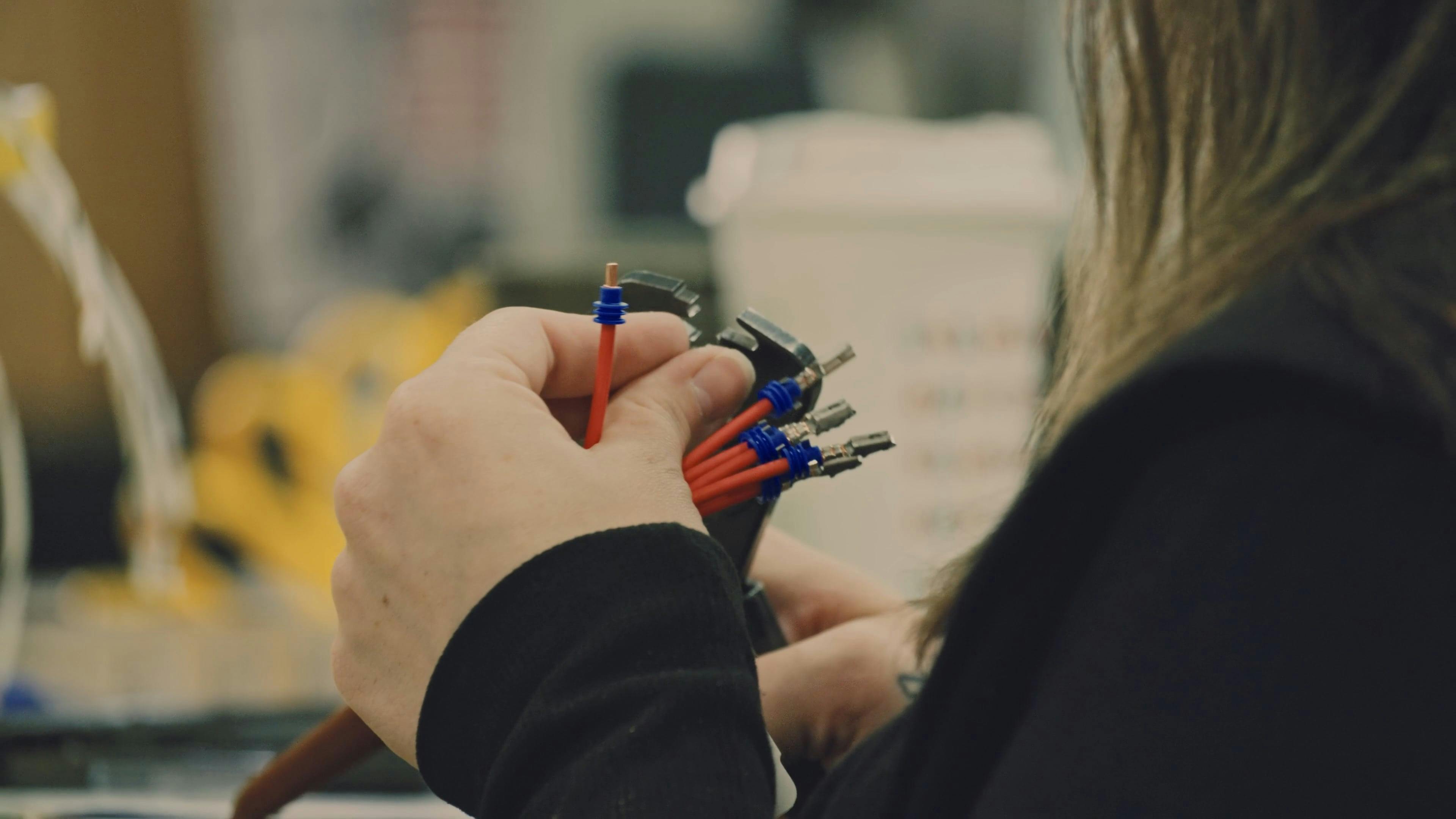 Fixing A Light Bulb In A Series Of Electric Wires · Free Stock Video