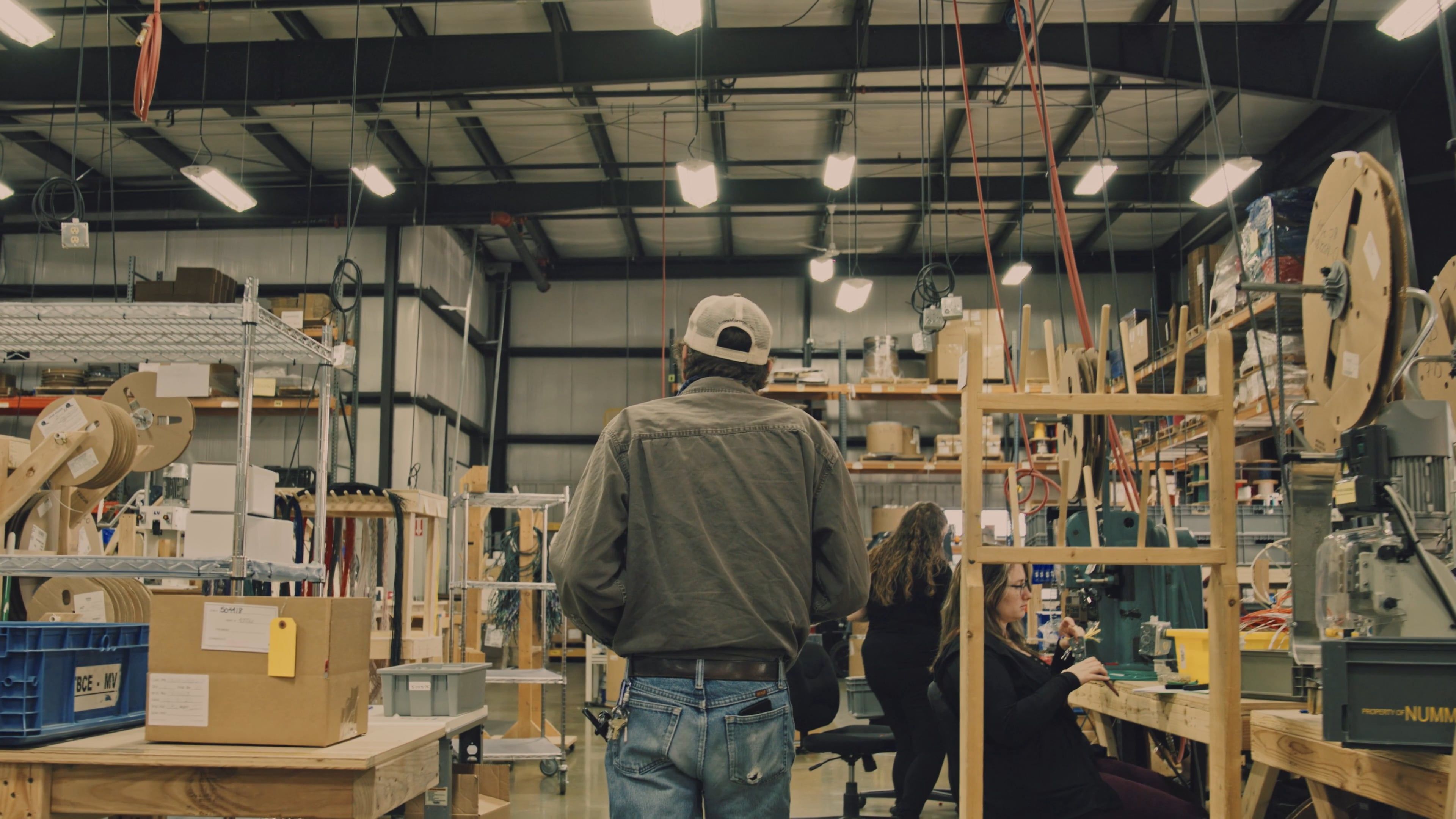 A Man Walking inside a Warehouse · Free Stock Video