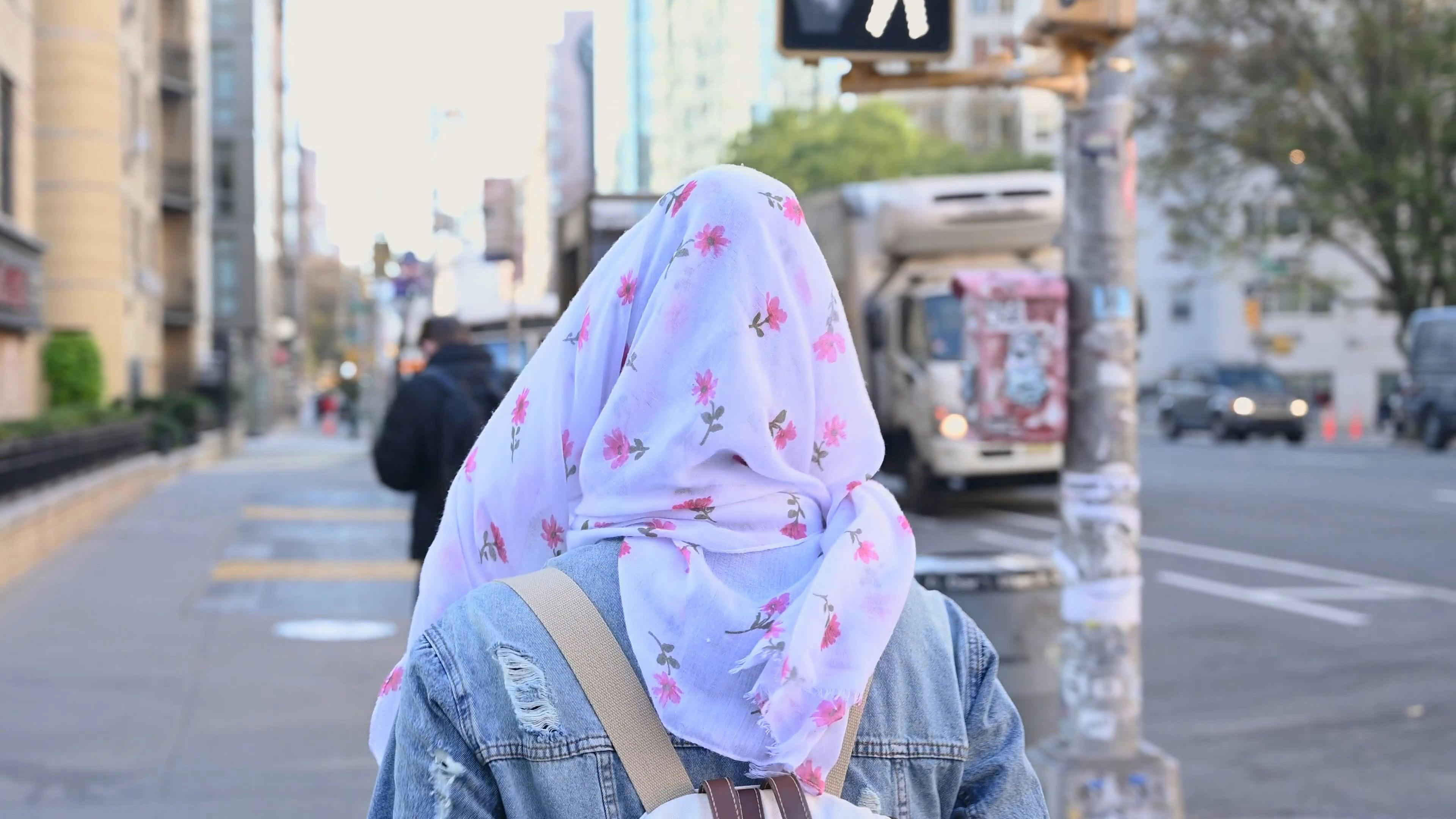 Back View of Woman with Headscarf Walking in Street Free Stock Video ...