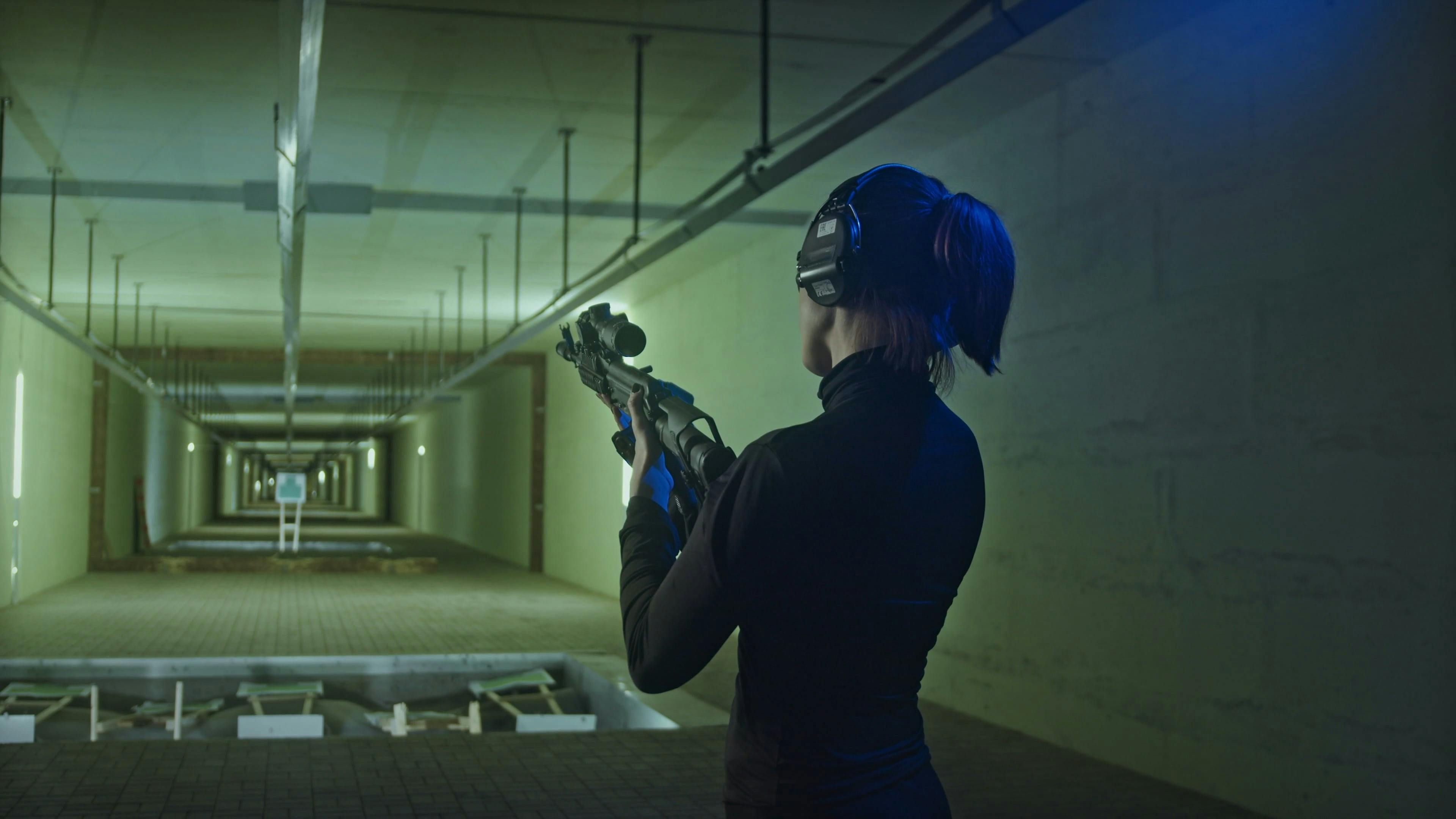 A Woman Firing a Rifle in a Shooting Range Free Stock Video Footage ...