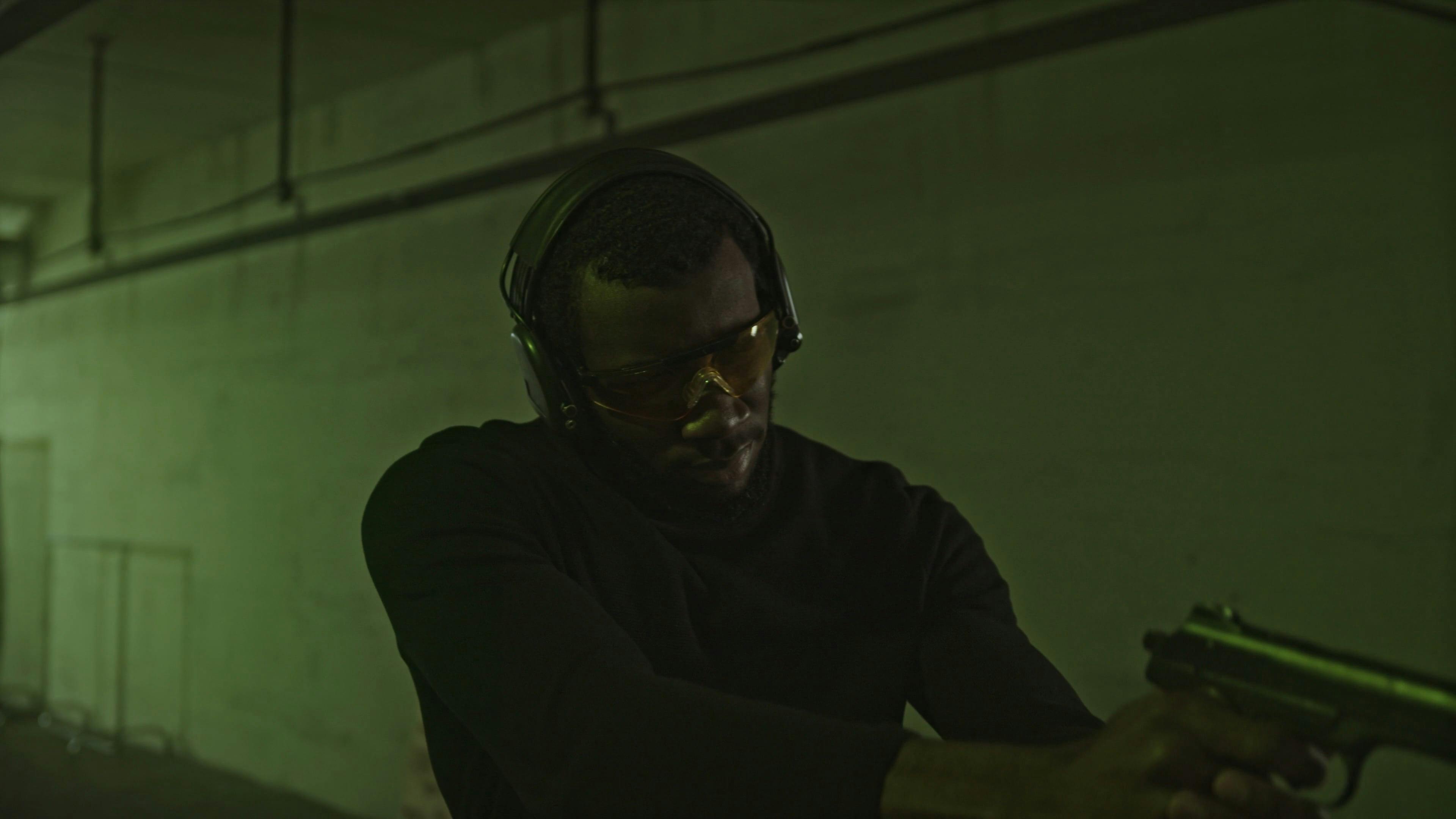 Man Aiming a Gun · Free Stock Video