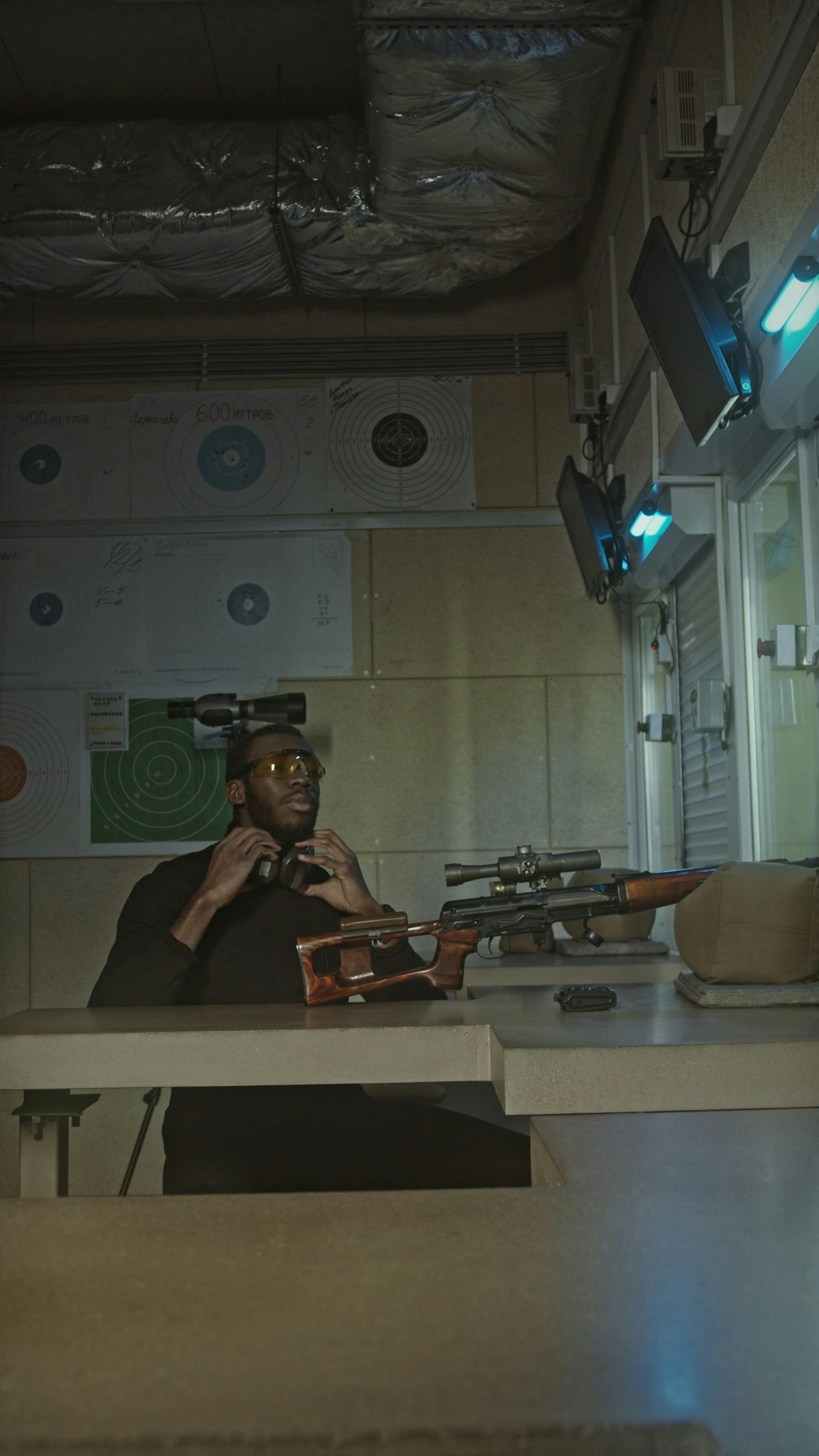 Man Reloading and Firing a Sniper Rifle · Free Stock Video