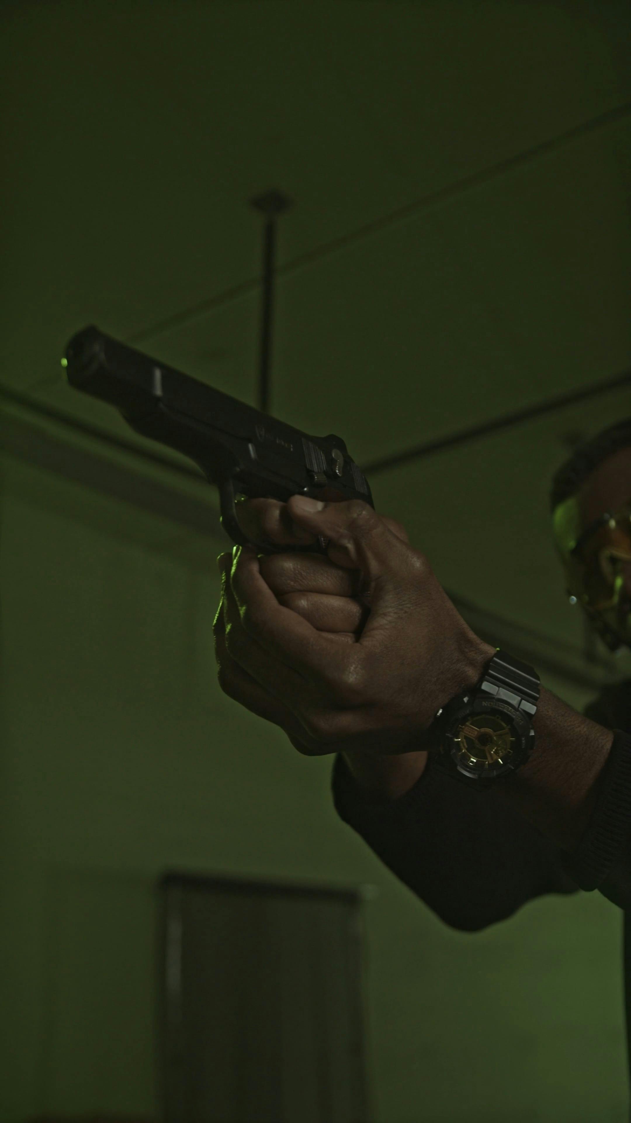 Man Aiming a Pistol · Free Stock Video