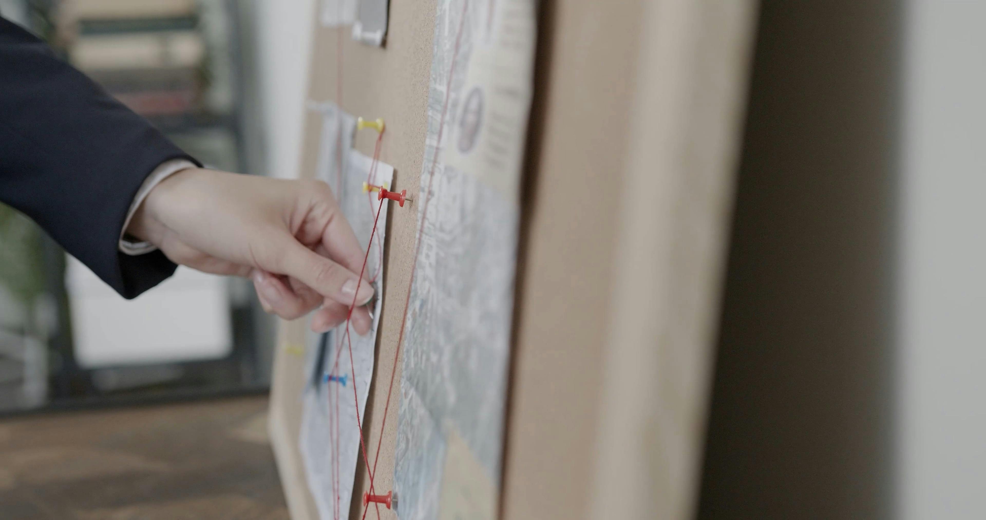 Close Up Shot of a Person Putting Pin on the Corkboard Free Stock Video ...