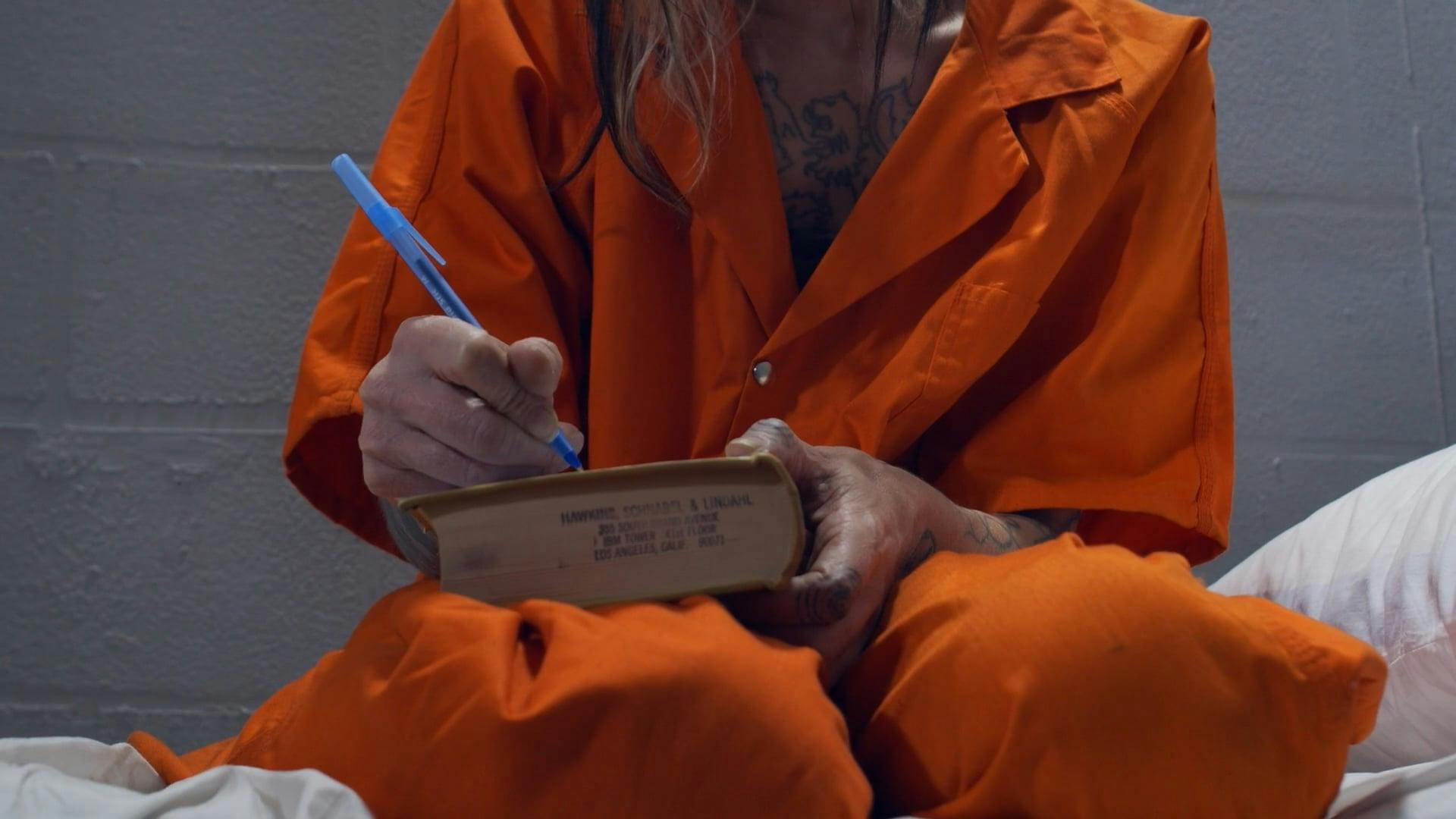Female Inmate Sitting on the Bed and is Writing a Letter Free Stock ...