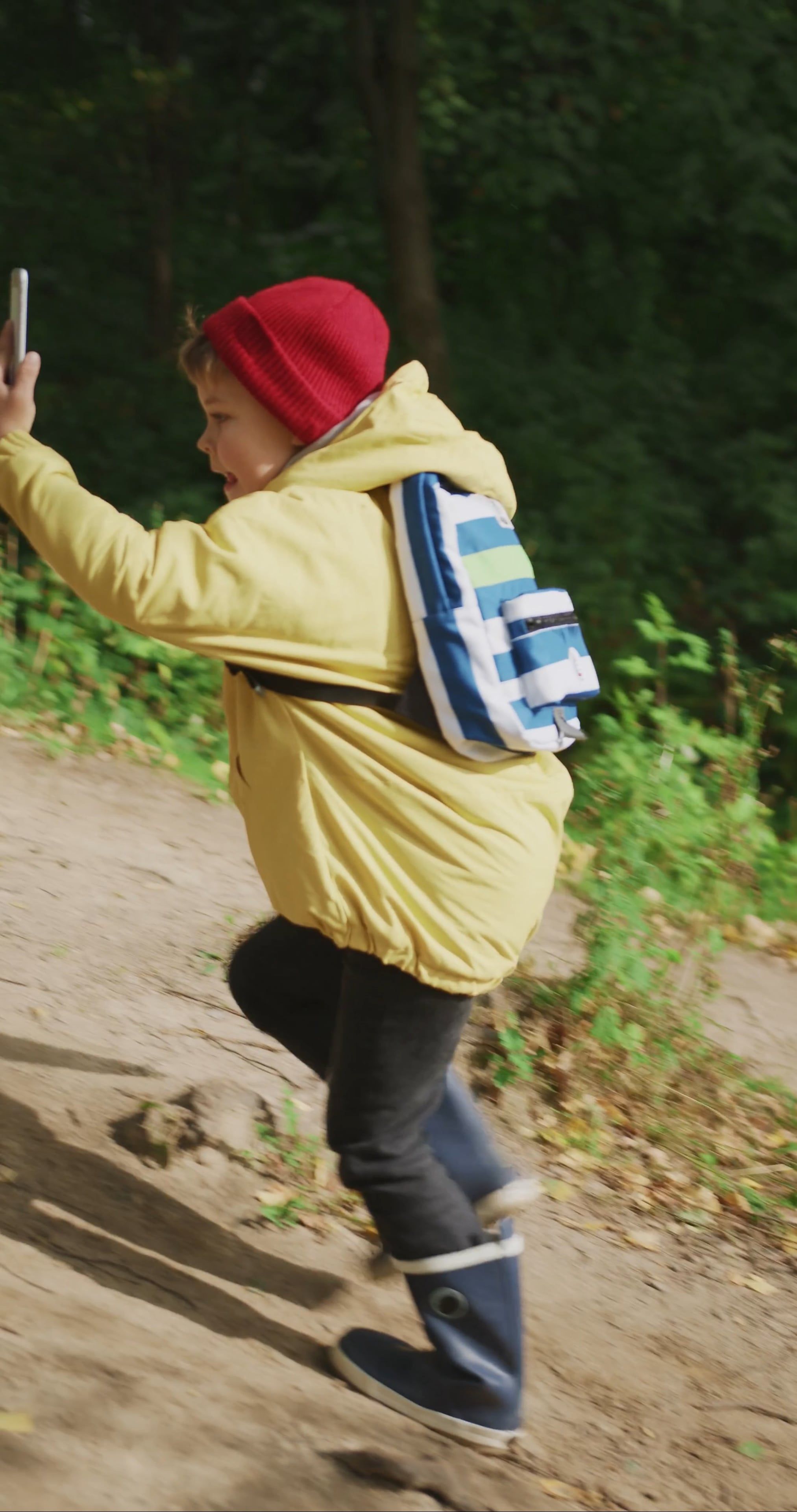 A Boy Searching for Signal while using Smartphone in the Forest · Free ...