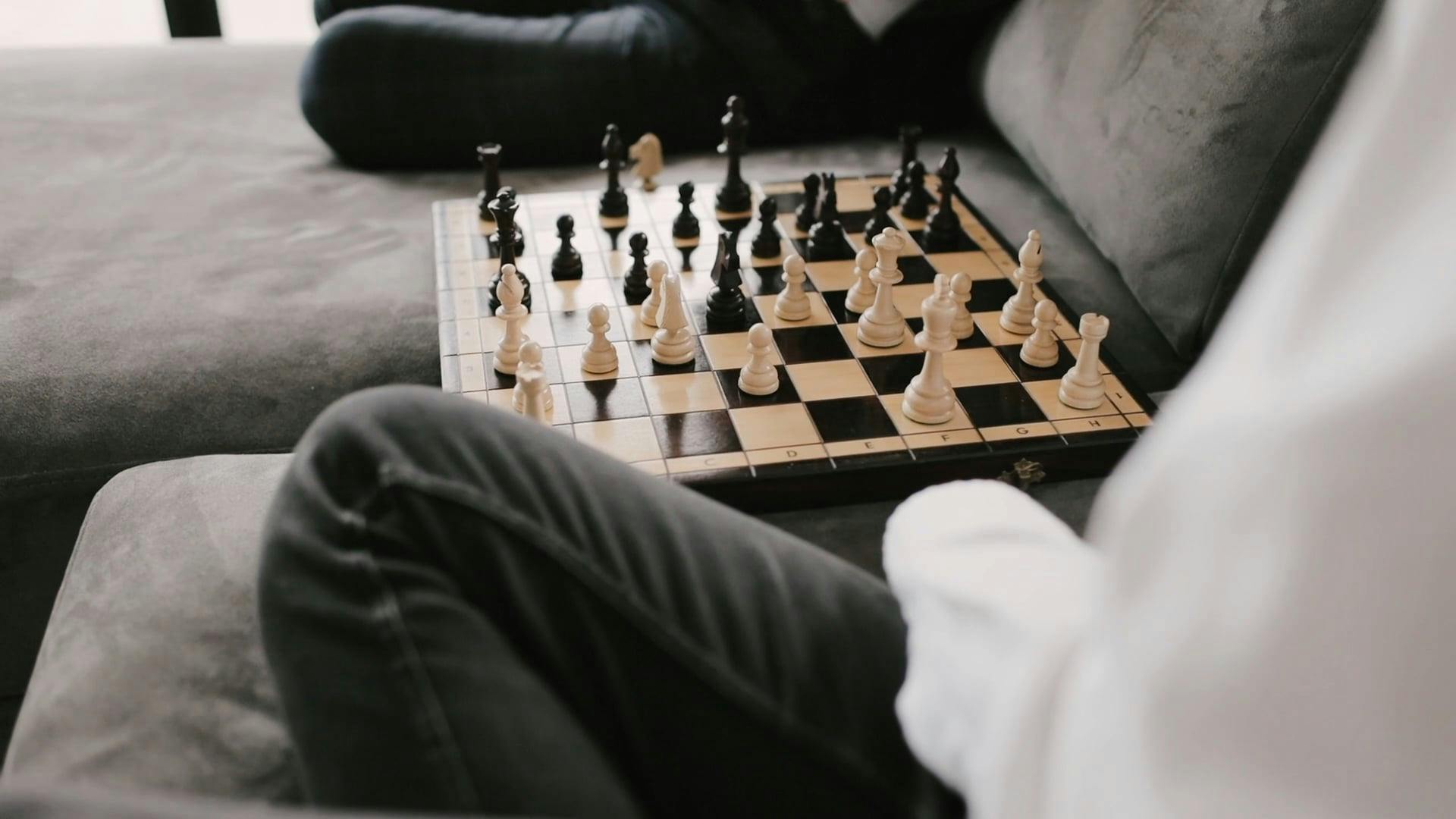 Two People Playing Chess in the Couch · Free Stock Video